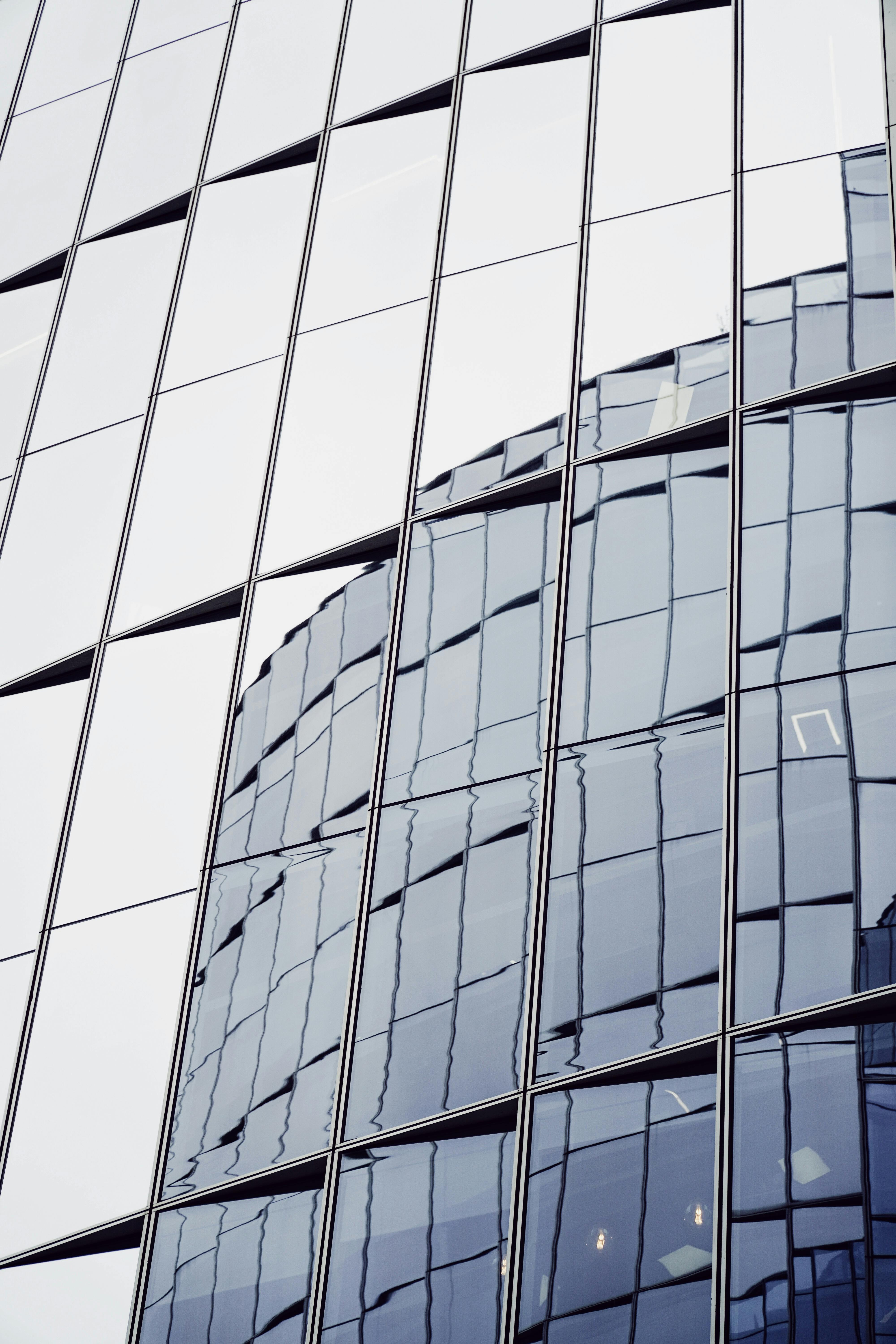 Building Reflecting in Glass Wall · Free Stock Photo