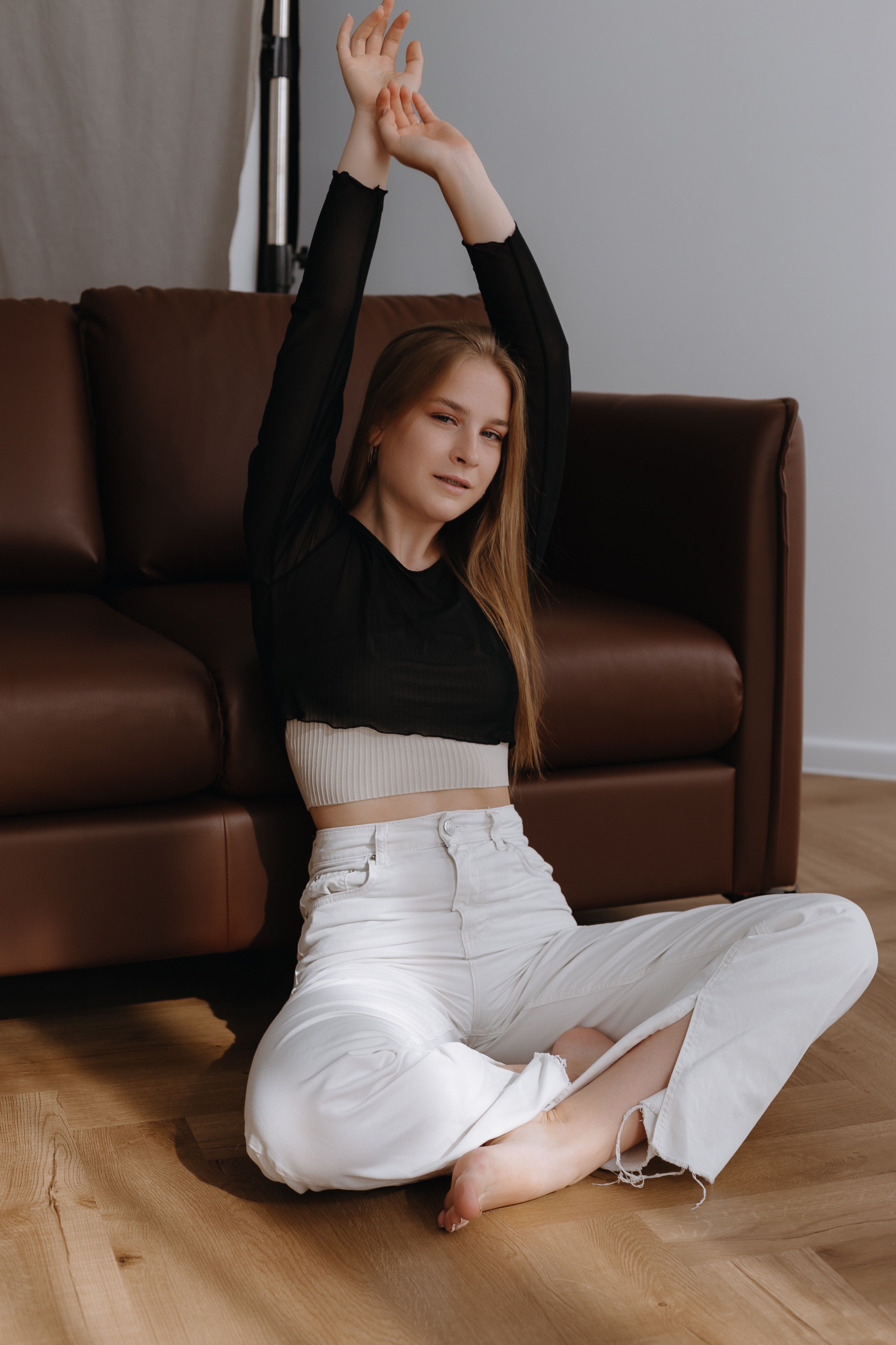 Photo of a Girl Wearing White Trousers Sitting on a Parquet · Free ...