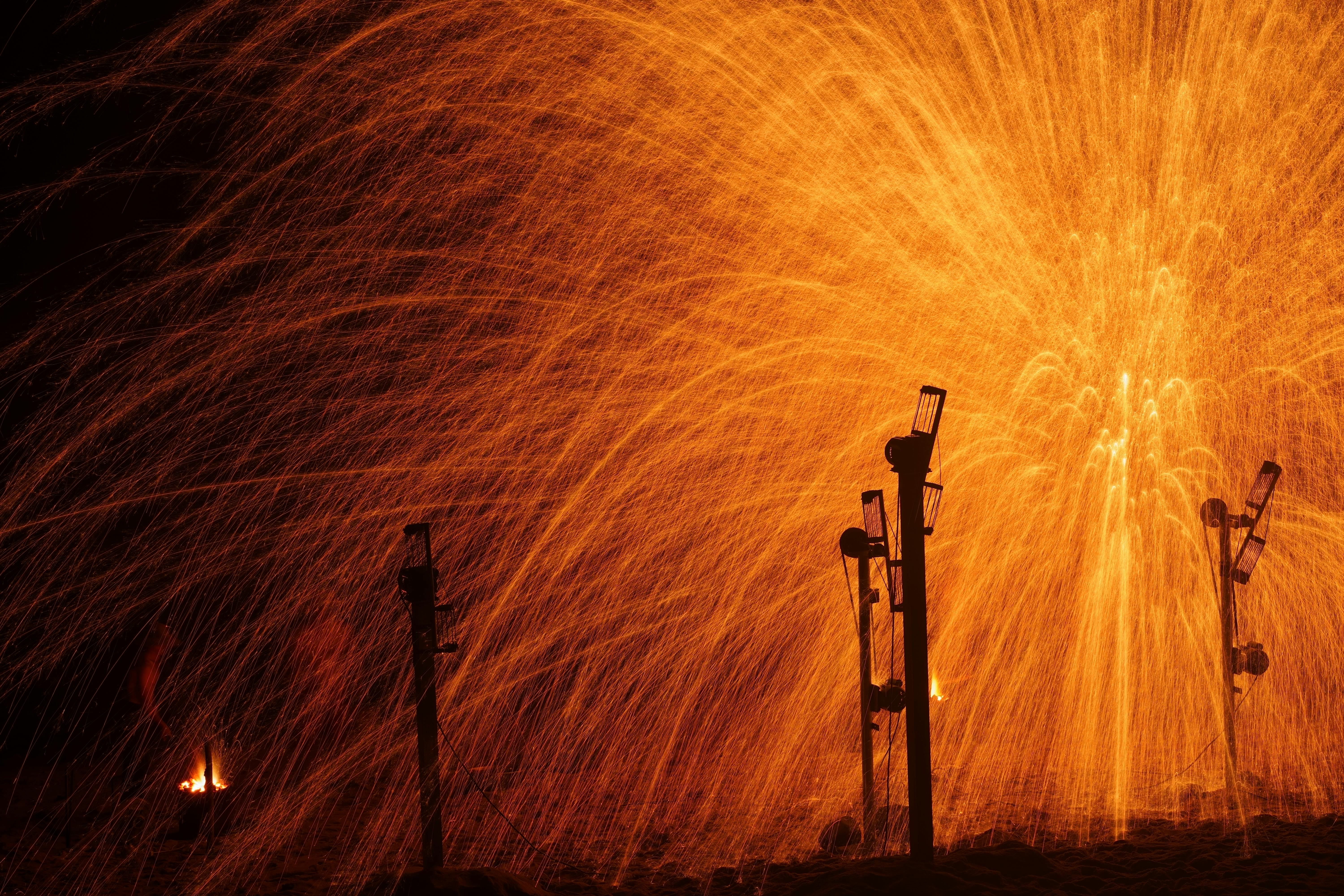 Time Lapse Photography of Person Making Firework Spark Under Person ...