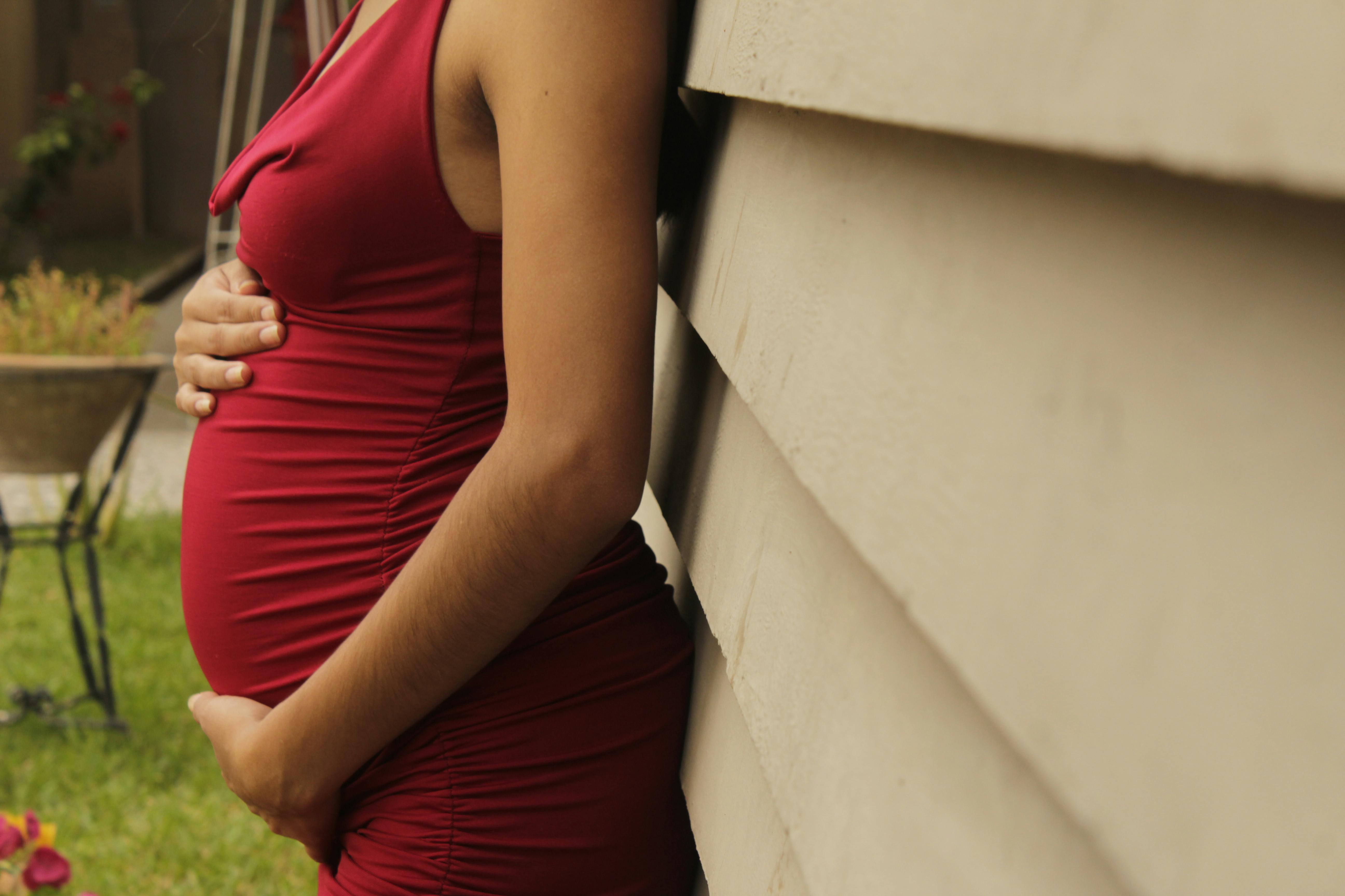 Pregnant Woman in Red Dress · Free Stock Photo