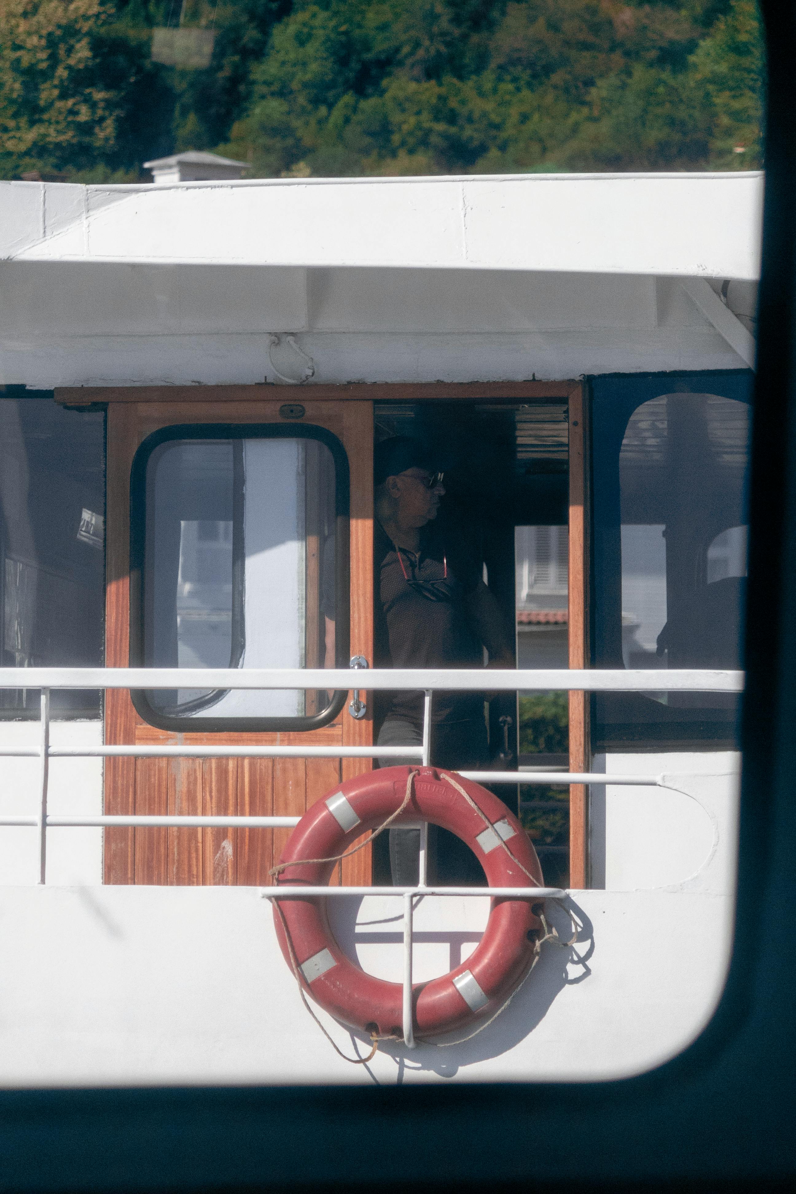 Seaman Standing at a Ship Control Tower · Free Stock Photo