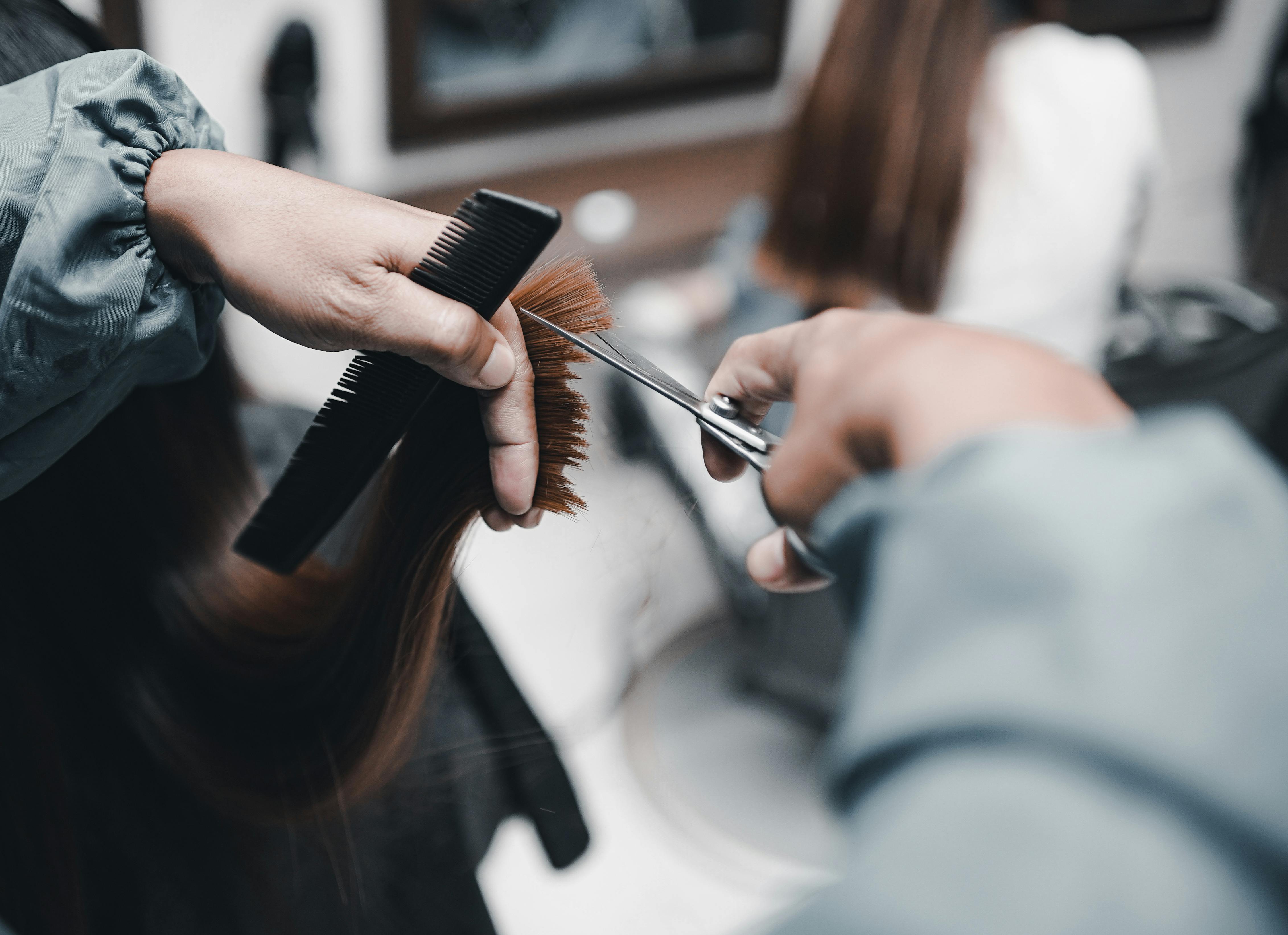 Hairdresser Cutting Hairs · Free Stock Photo