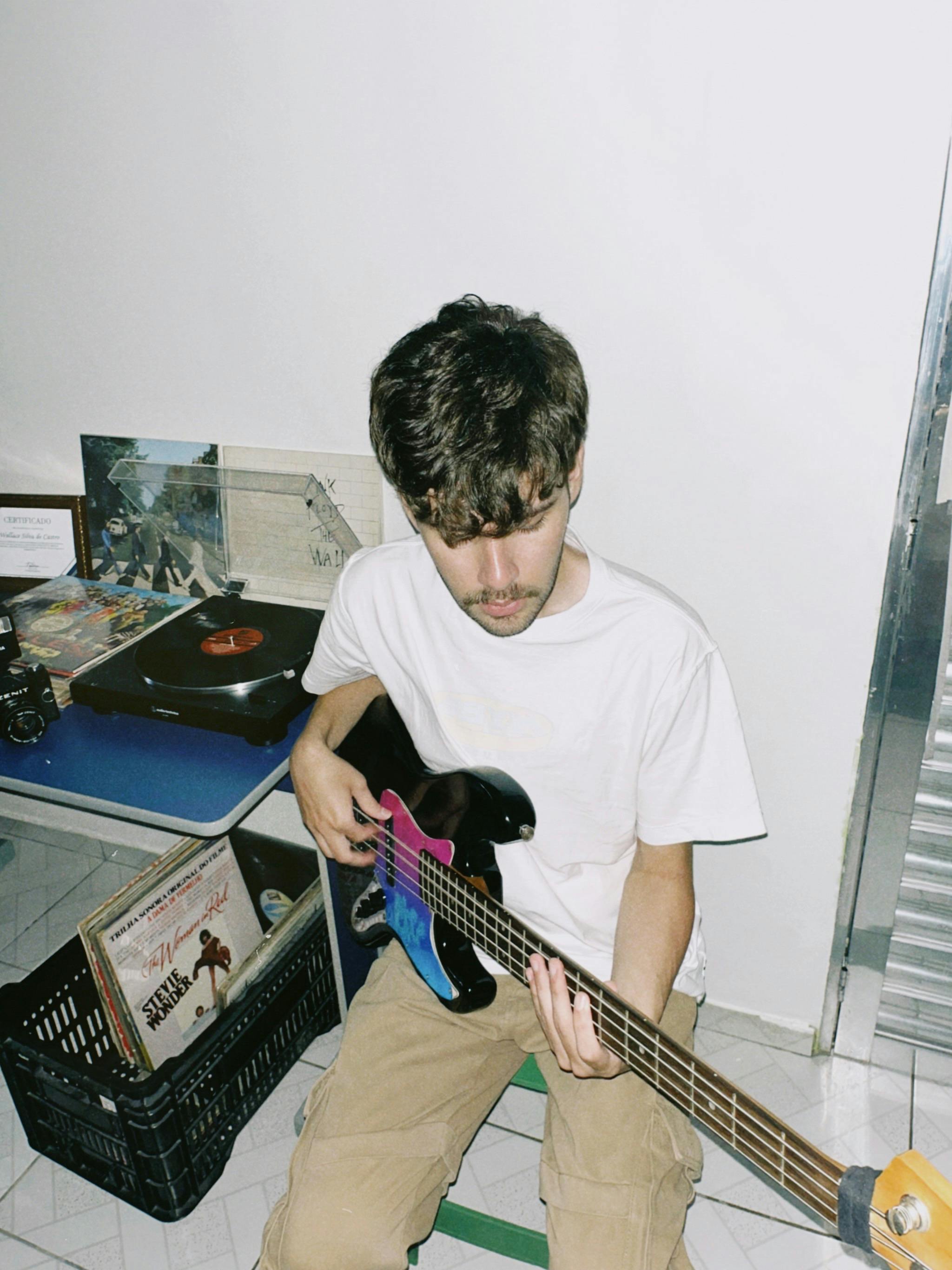 Sitting Man with Electric Guitar · Free Stock Photo