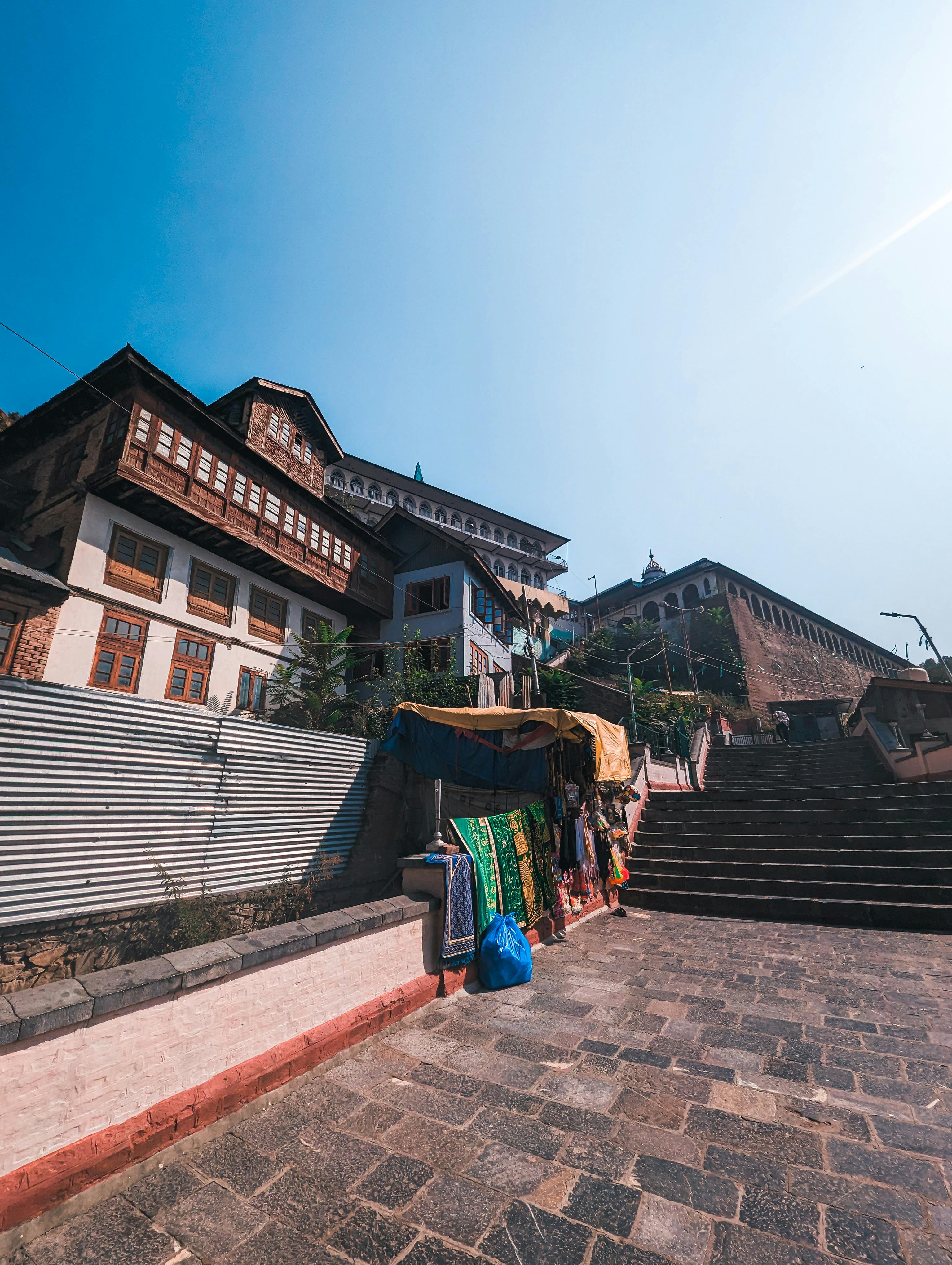 Merchant Stall Near Stairs in Town · Free Stock Photo