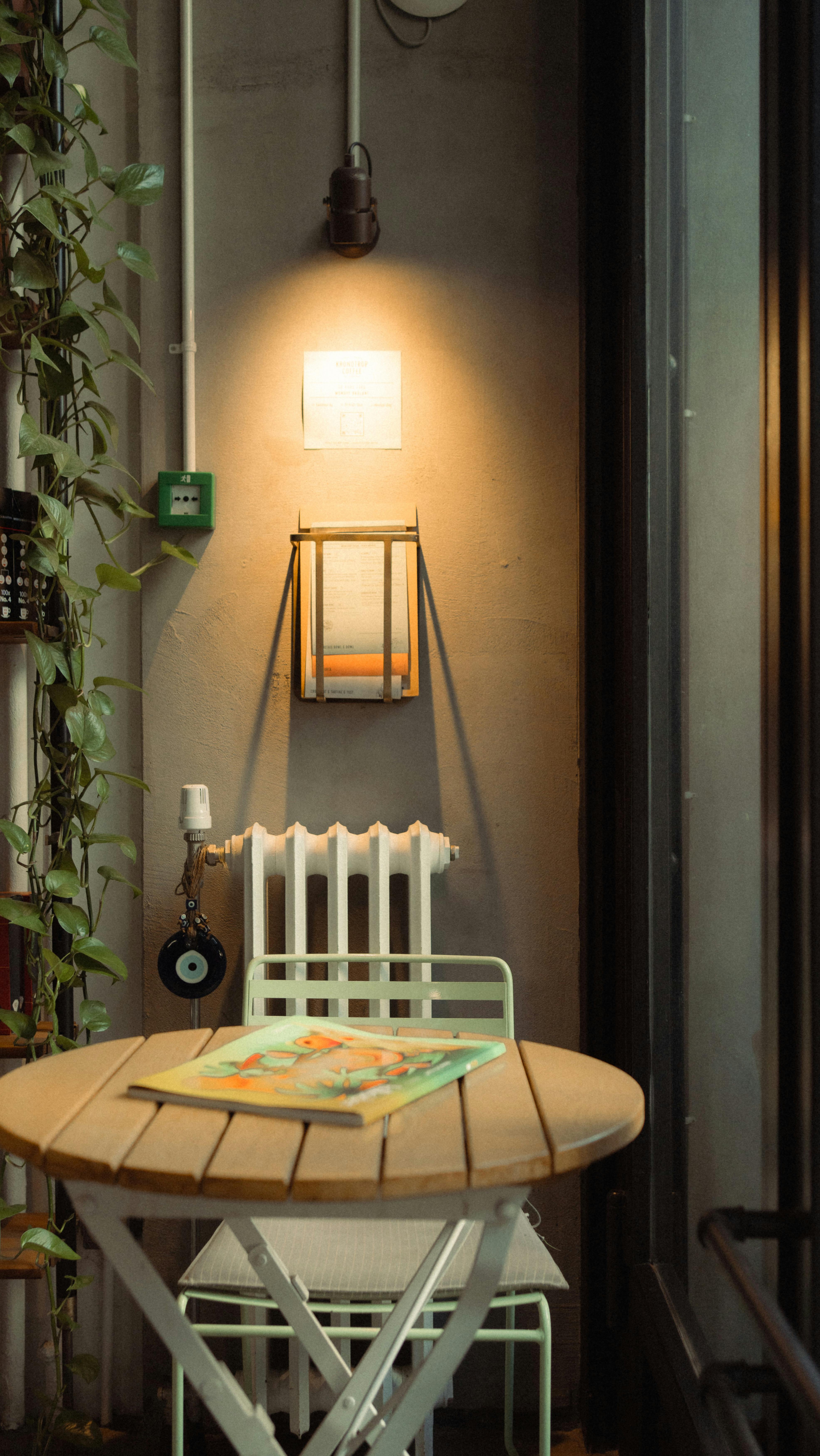 Lamp over Table with Magazine · Free Stock Photo