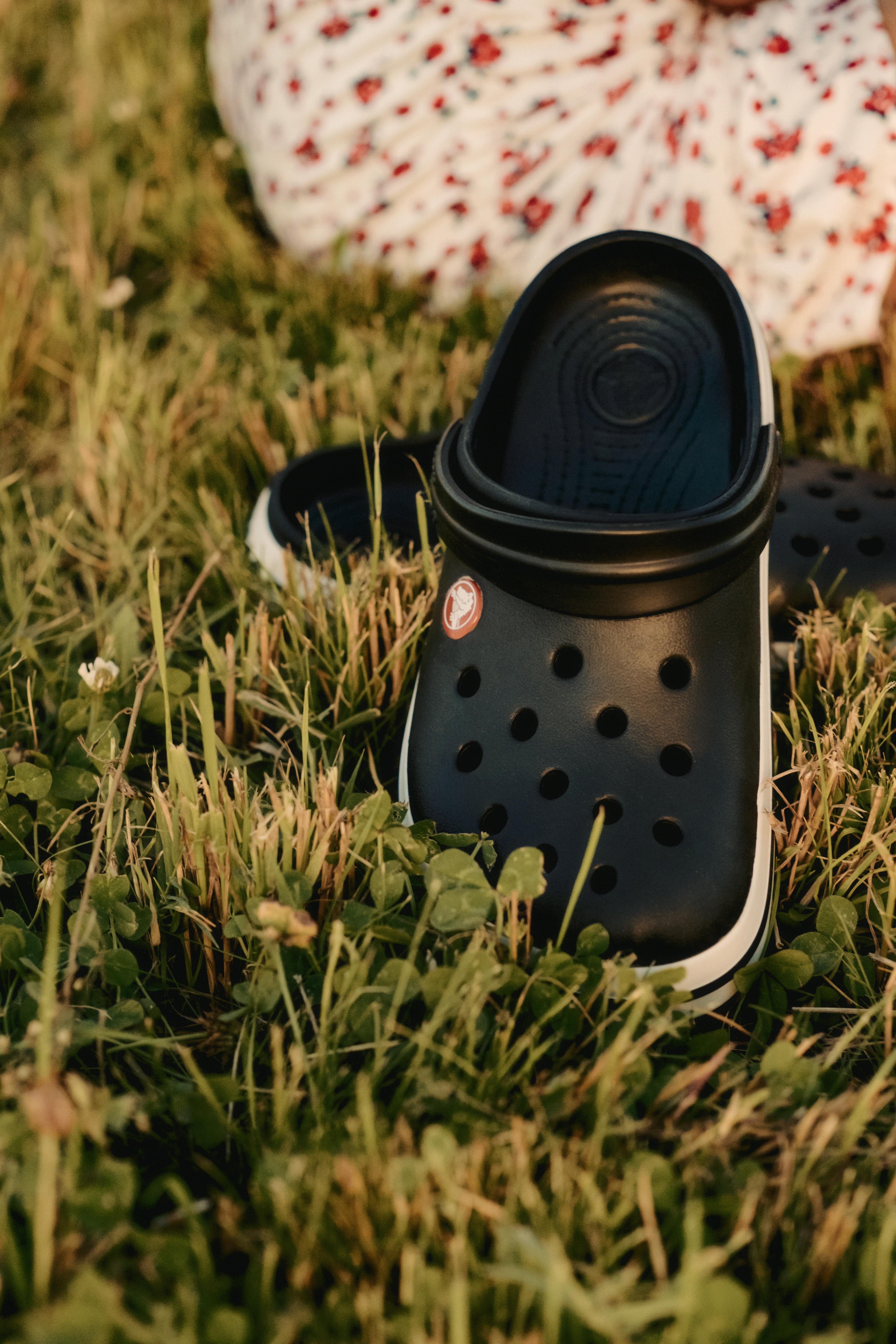 Black Crocs on Grass in Garden · Free Stock Photo