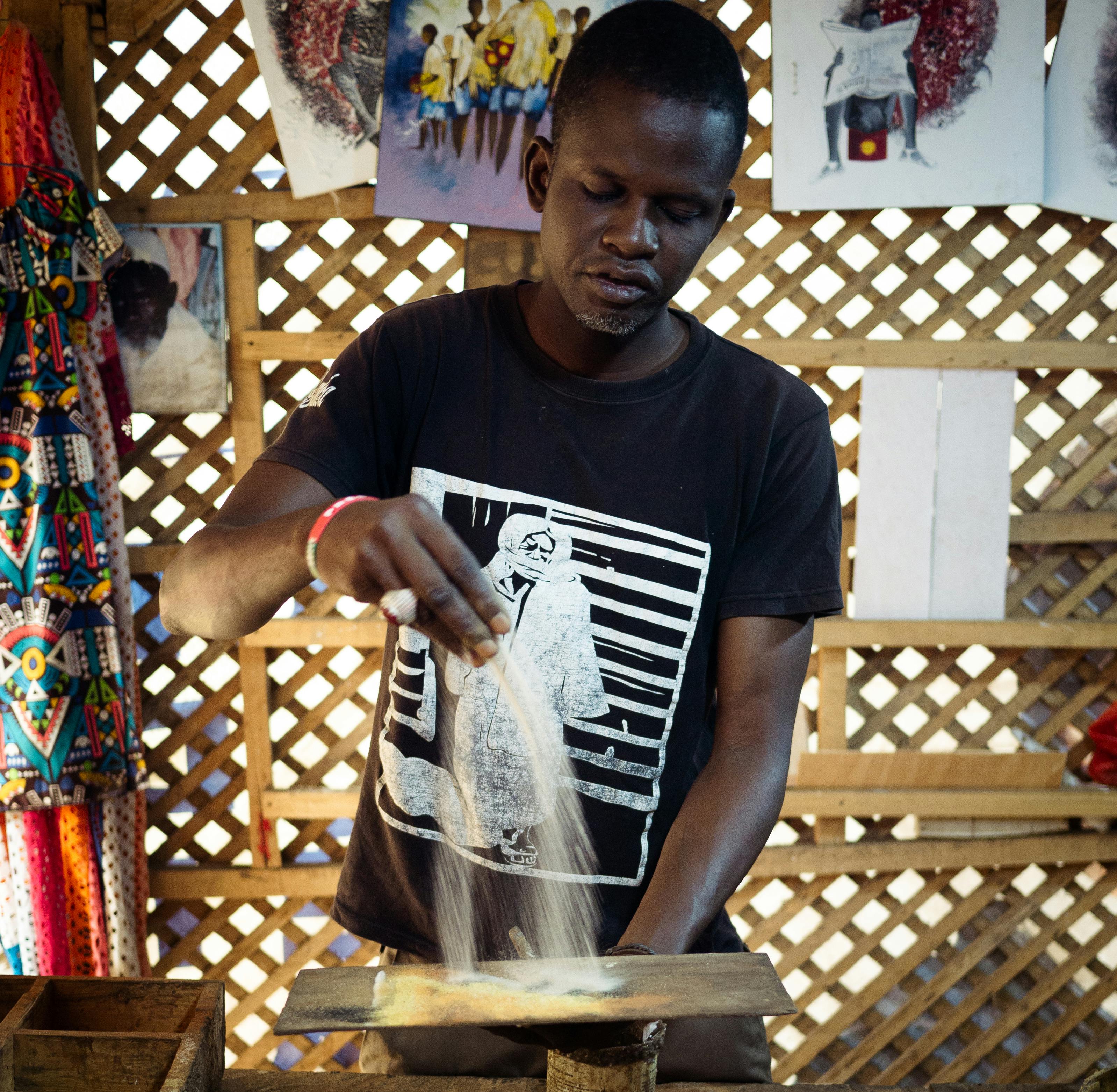Man in T-shirt Standing and Sipping Flour · Free Stock Photo