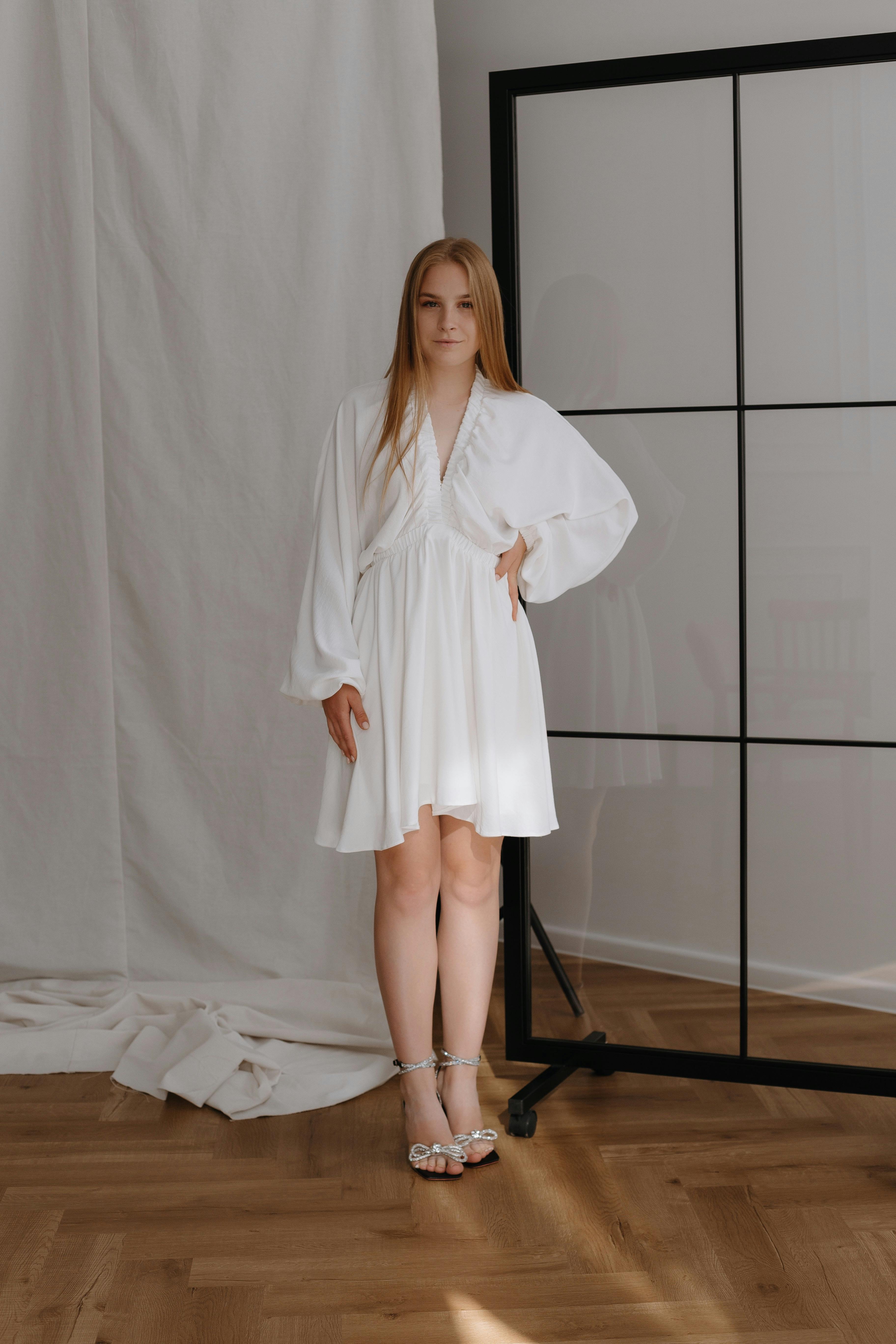 Woman Standing in White Modest Skirt and Holding Hand on Hip · Free ...