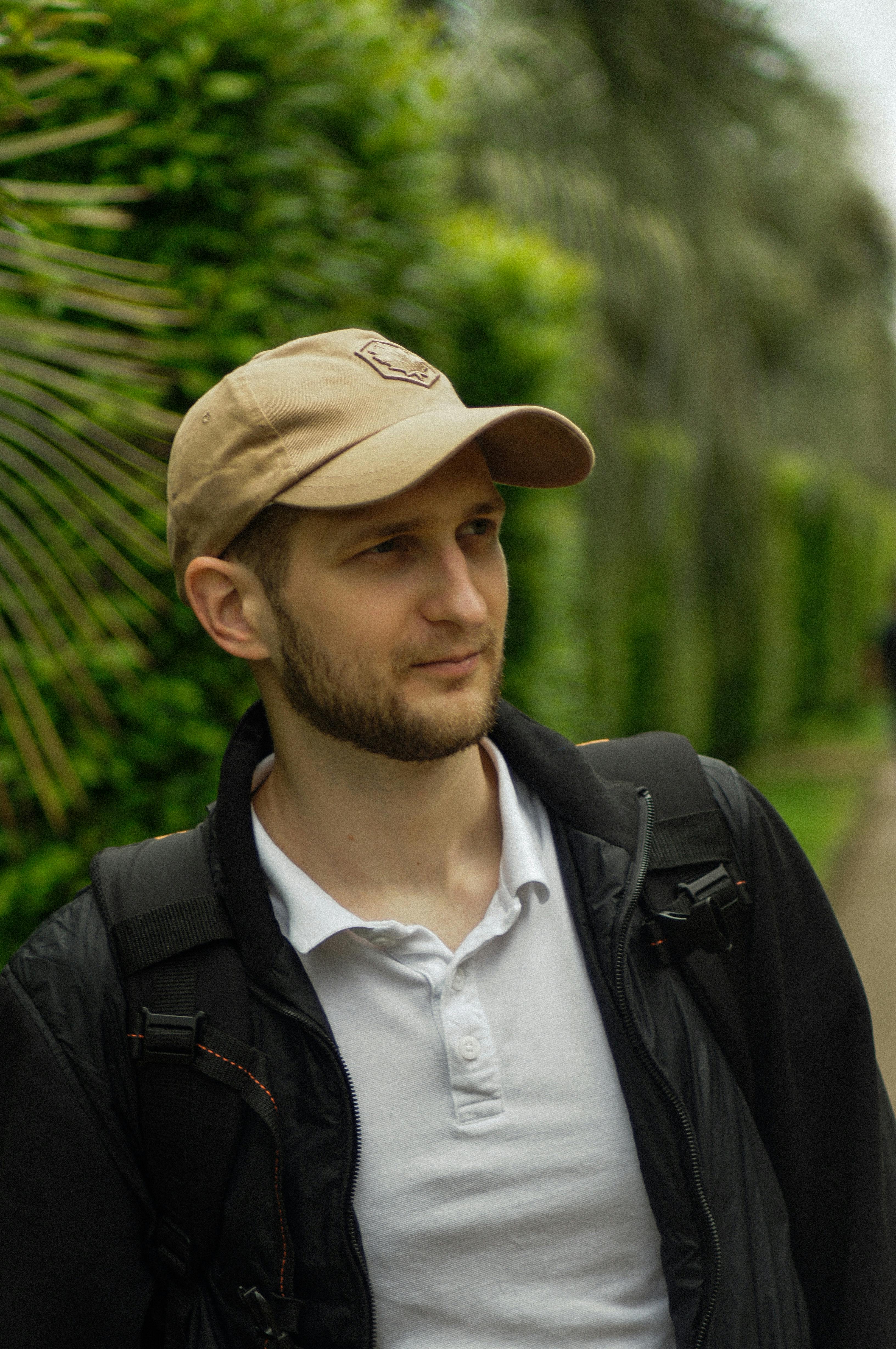 Man in Baseball Cap with Backpack · Free Stock Photo