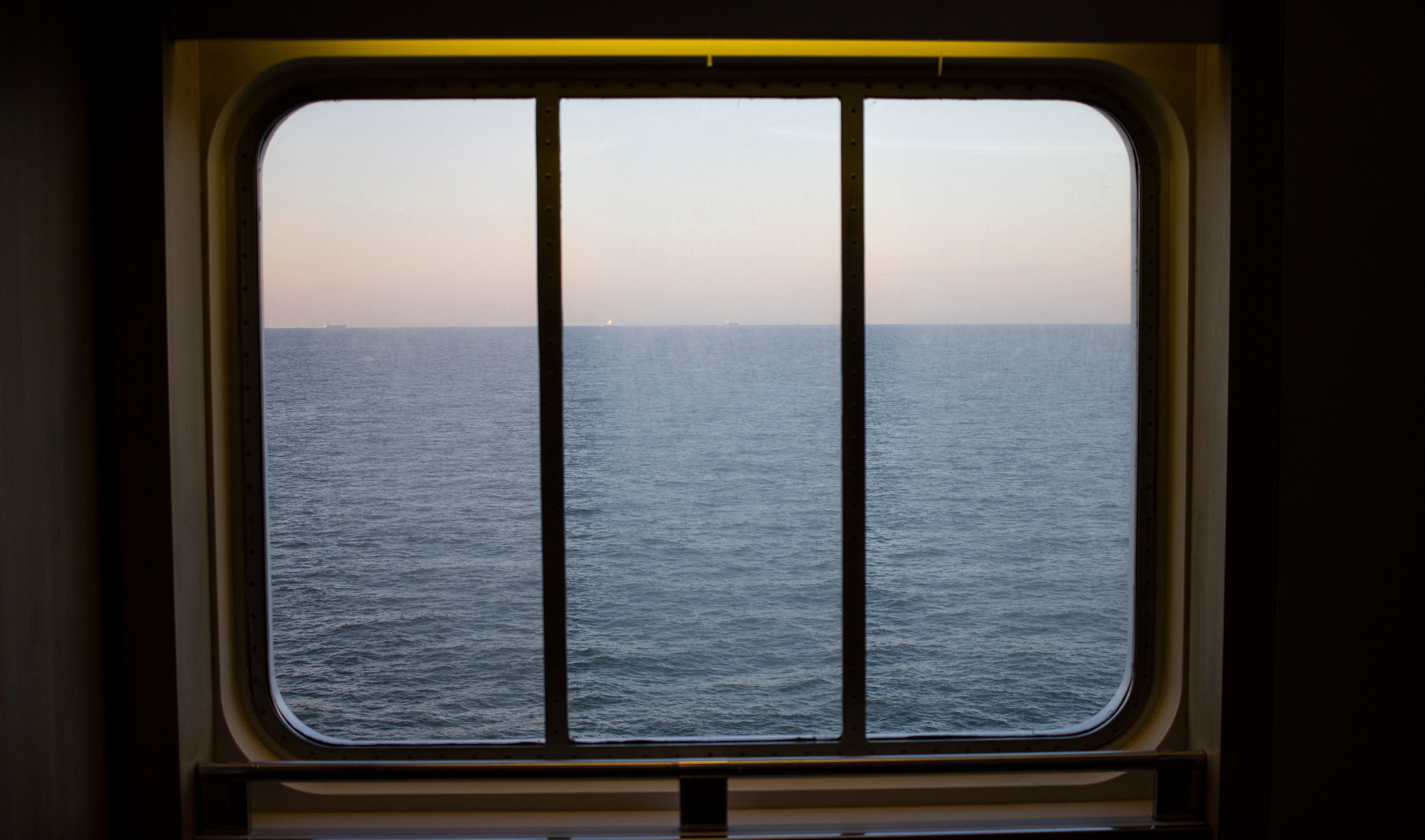 Open Sea behind Window · Free Stock Photo