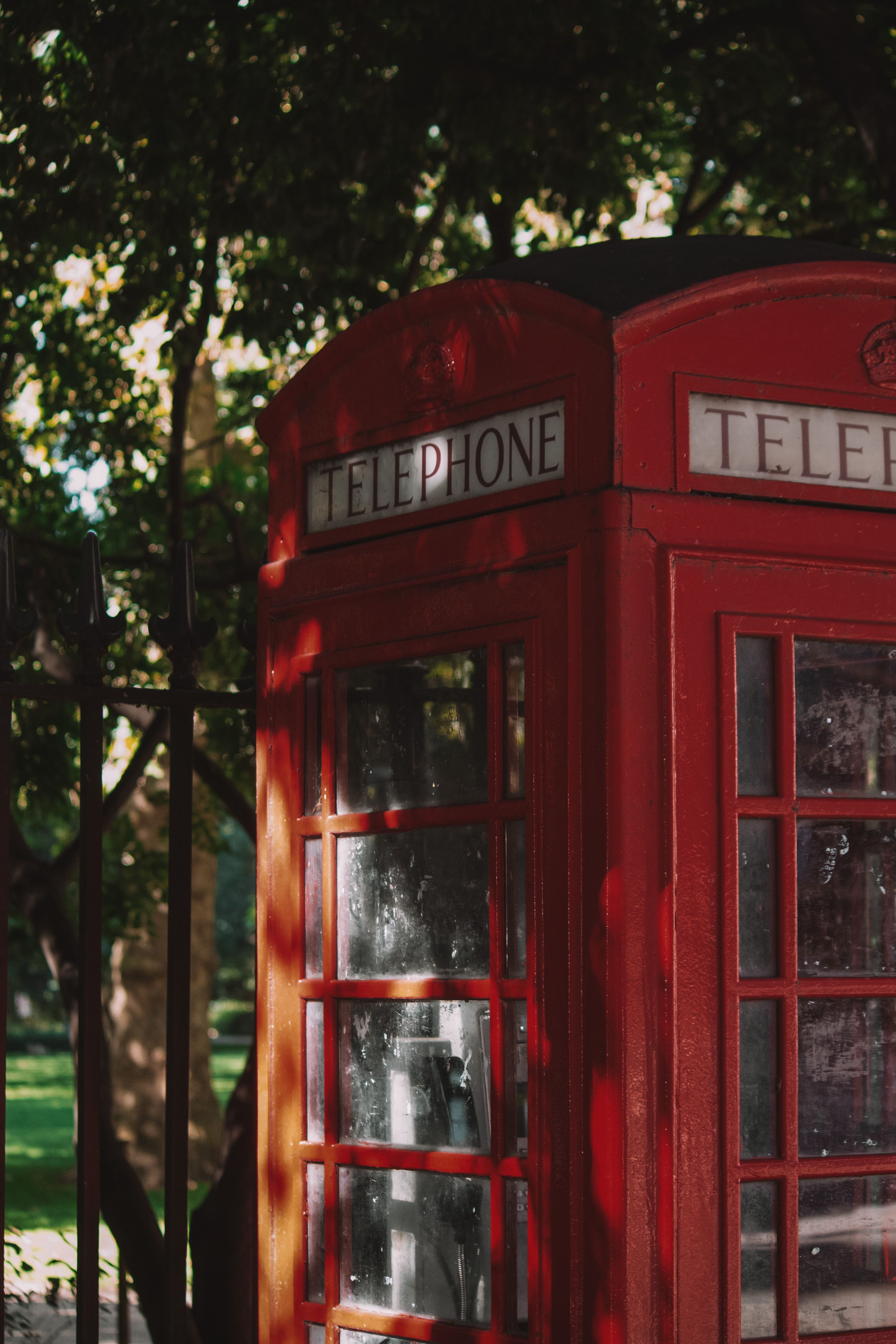 Telephone Booth in Shadow · Free Stock Photo