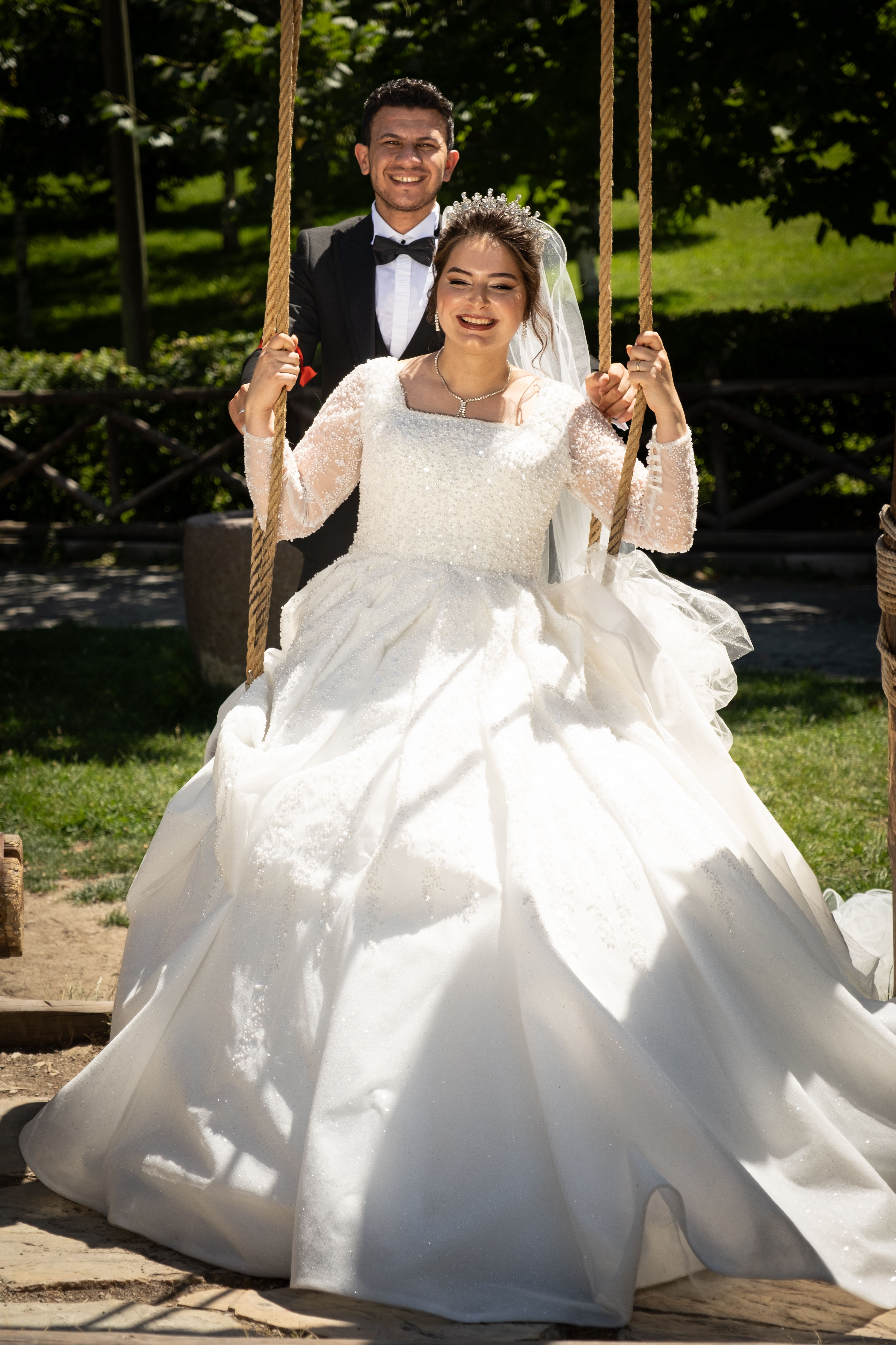 Smiling Bride Swinging by Groom · Free Stock Photo