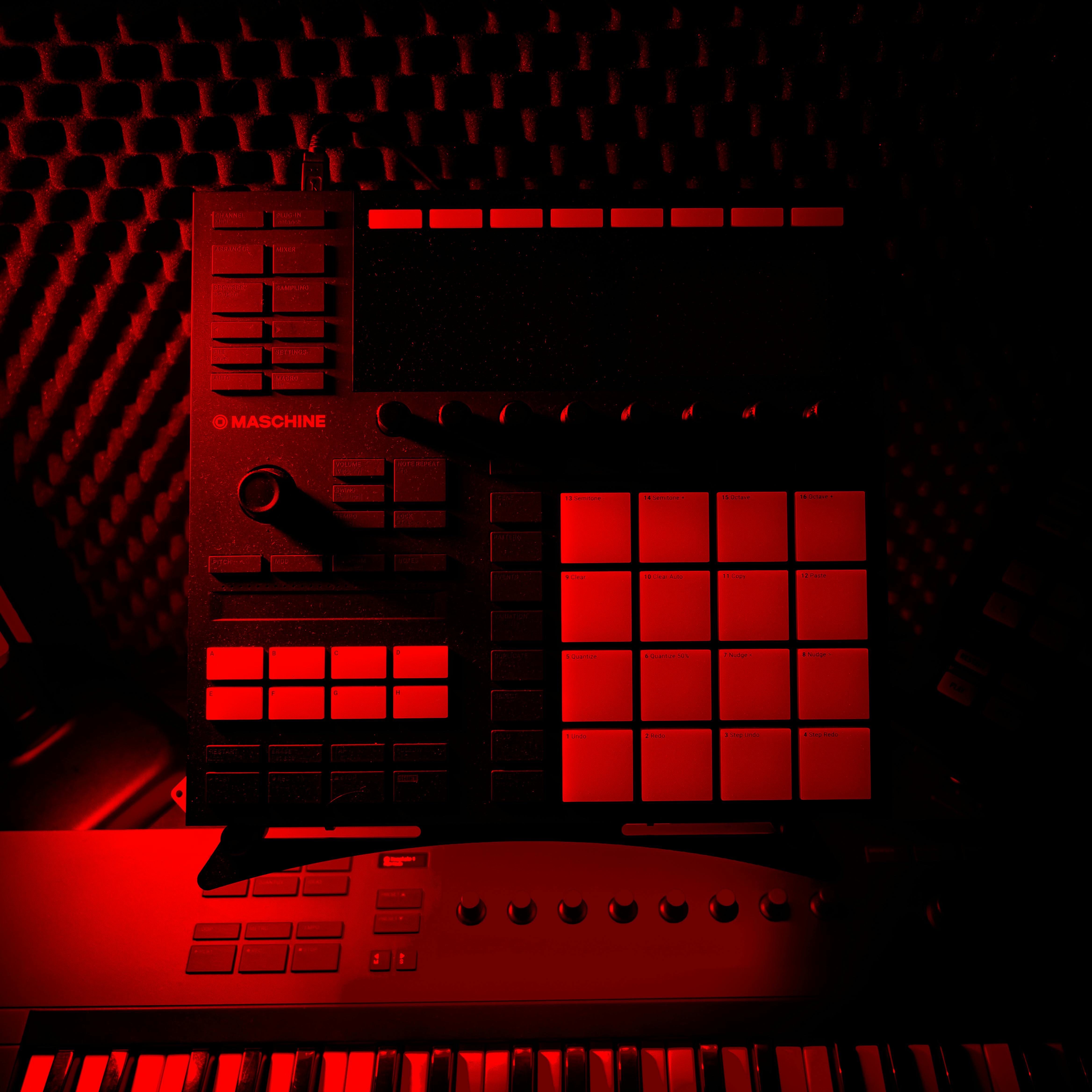 Red close view of a Native Instruments Maschine drums machine in a recording studio at Orbital ...
