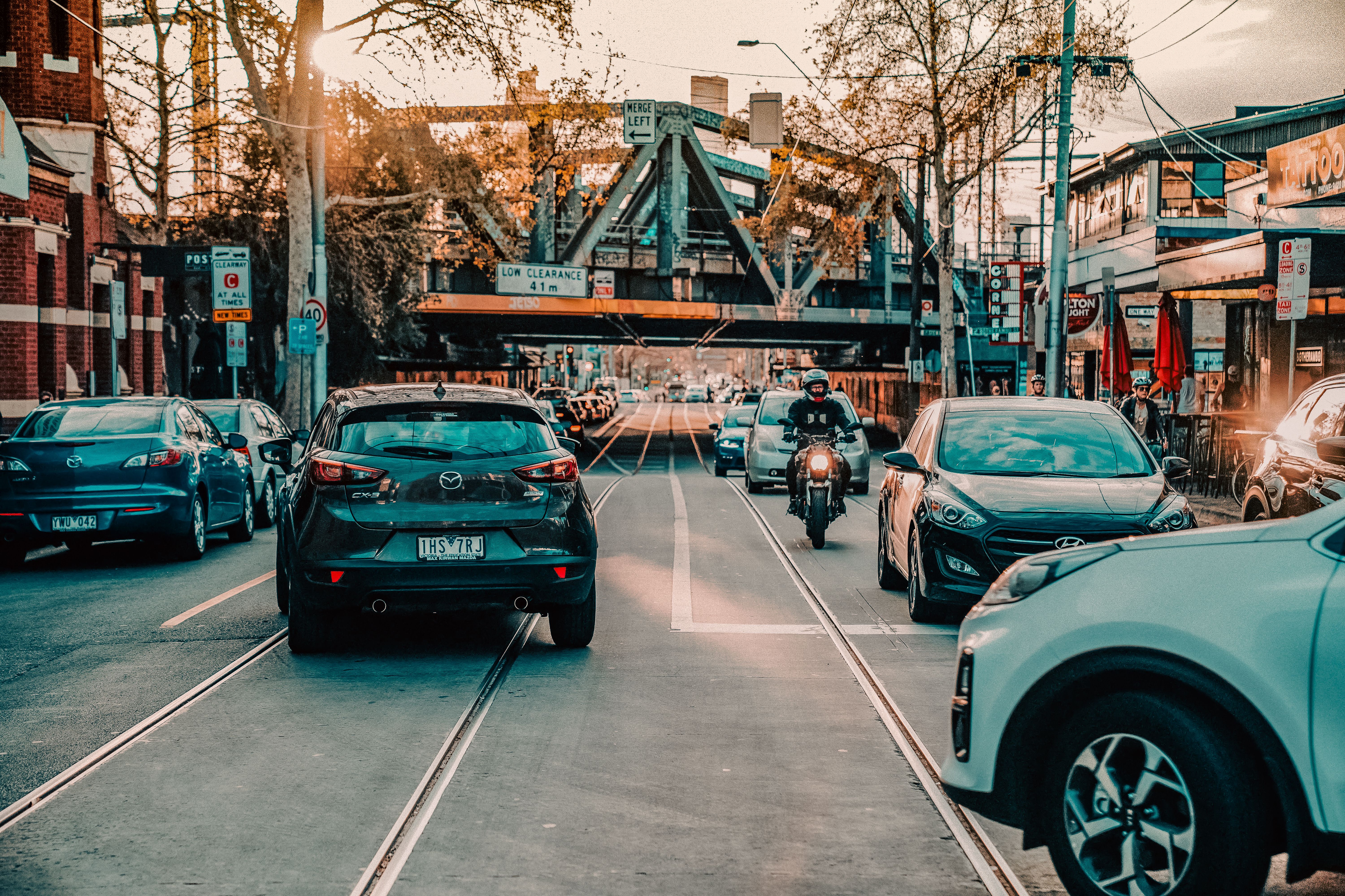 Traffic on Street with Truss Bridge over · Free Stock Photo