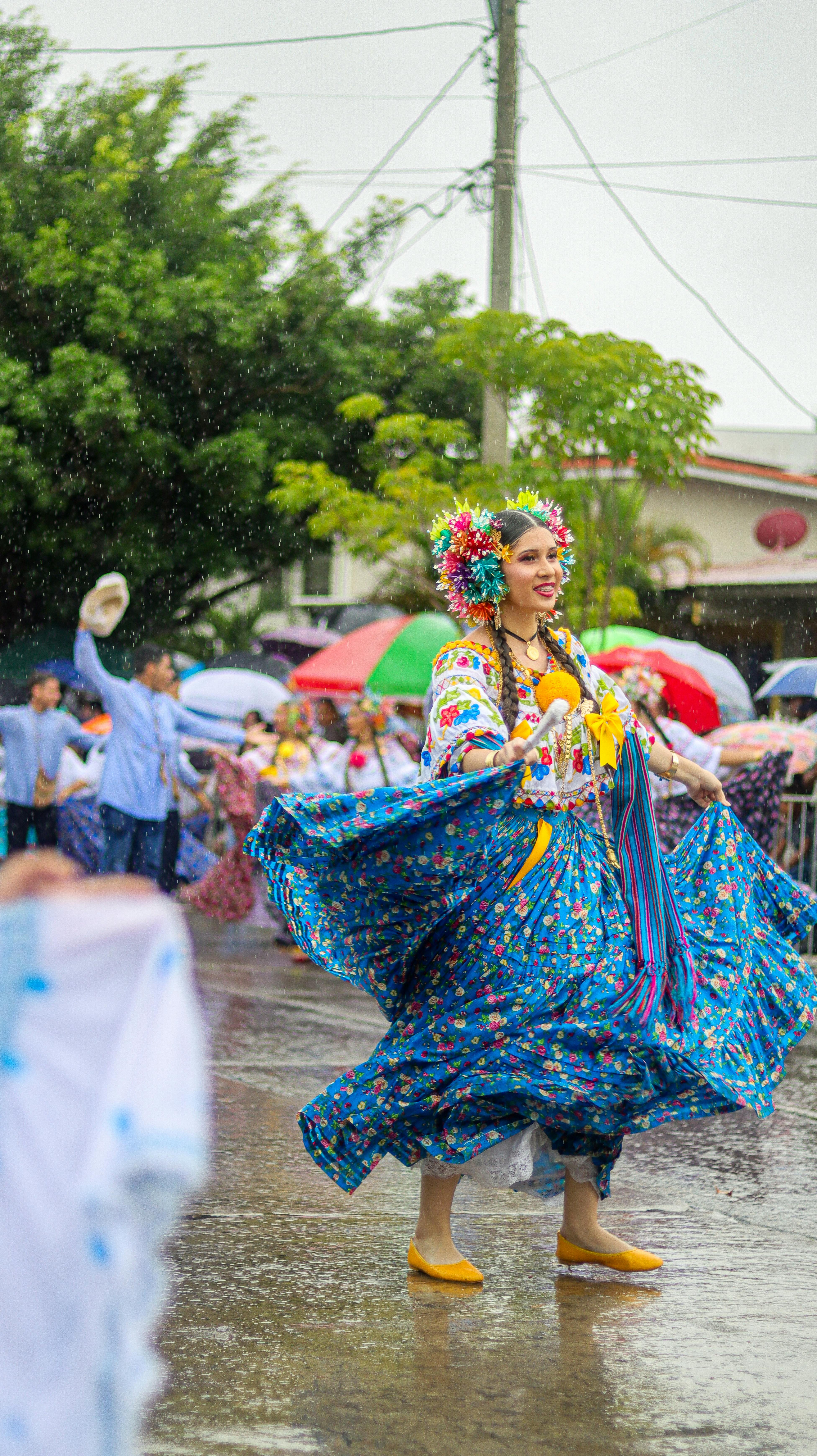 Woman in a Blue Pollera Dress Dancing in the Rain at a Parade · Free ...