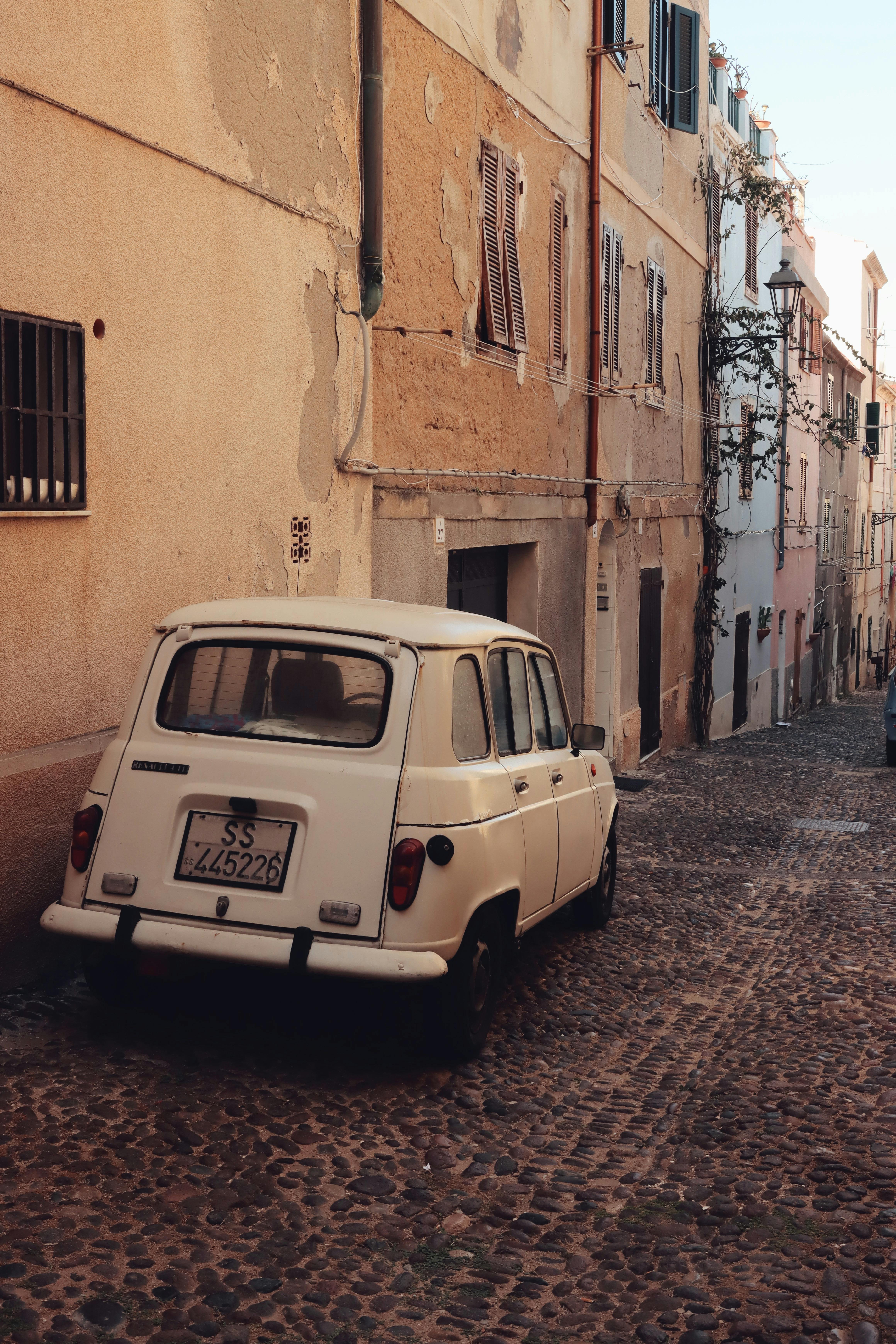 Vintage Renault 4 on Cobblestone Street in Town in Italy · Free Stock Photo