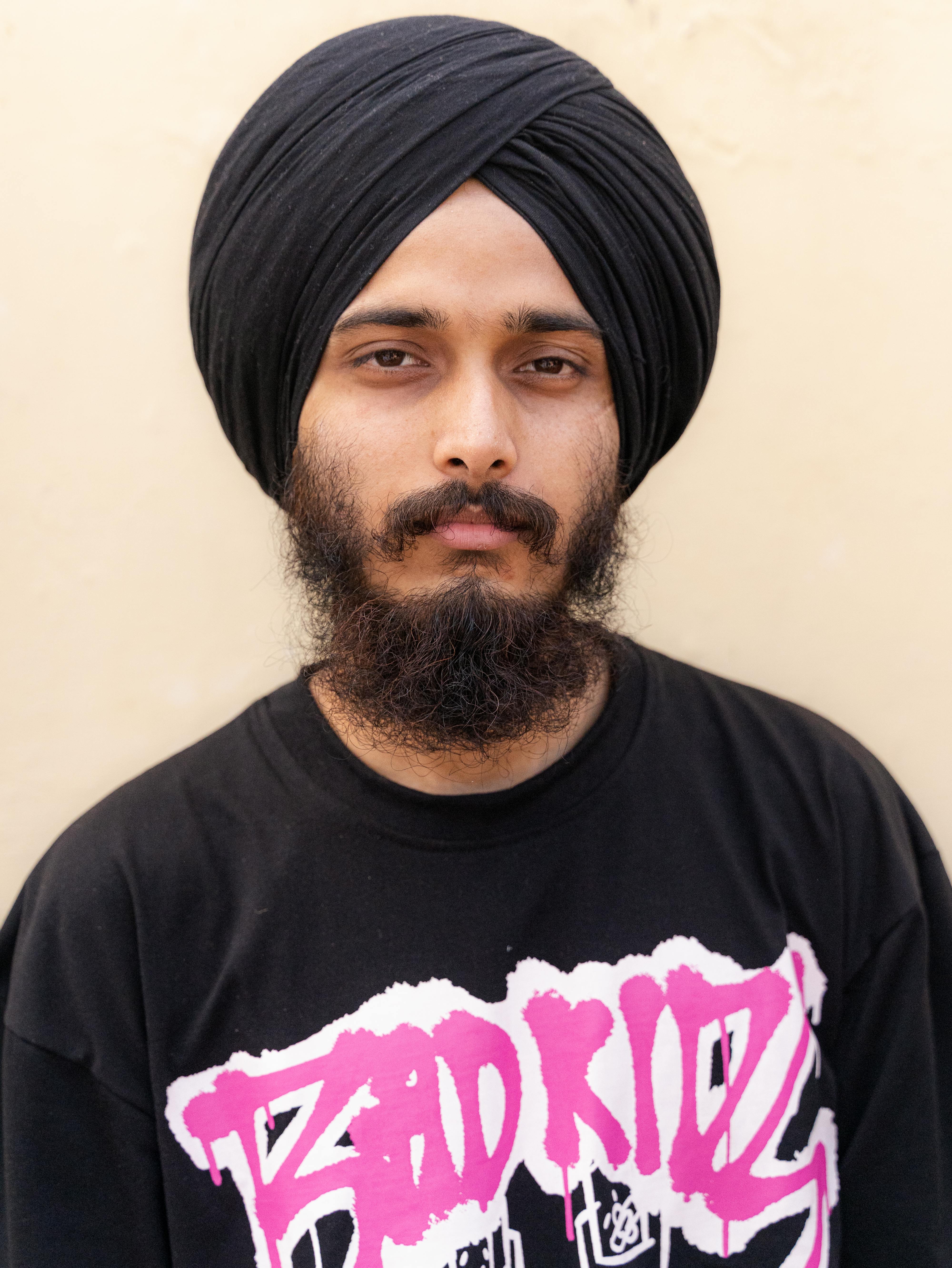 Man in a Black Turban and a Printed T-shirt · Free Stock Photo