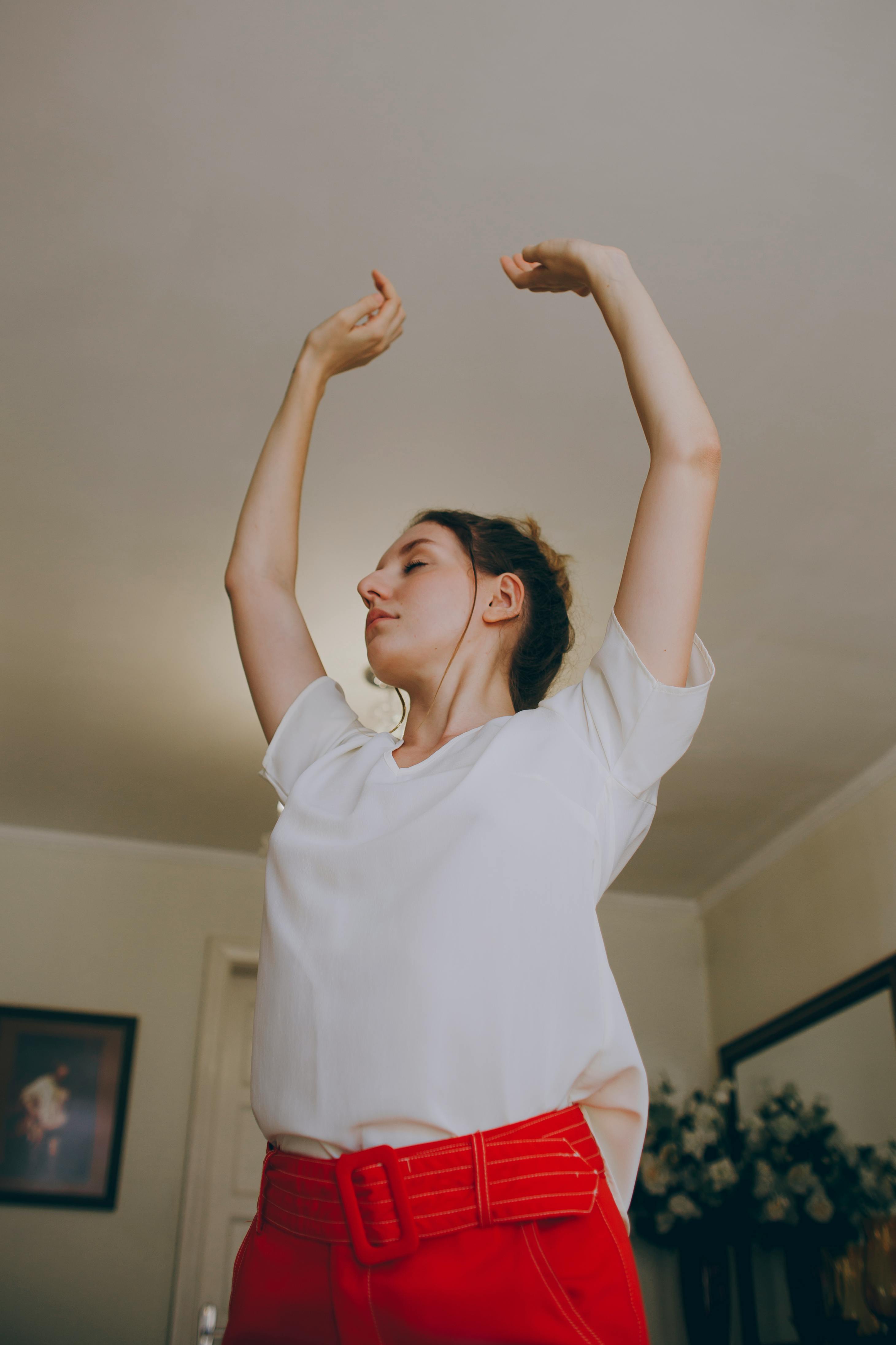 Photo of Woman Raising Her Both Hands · Free Stock Photo