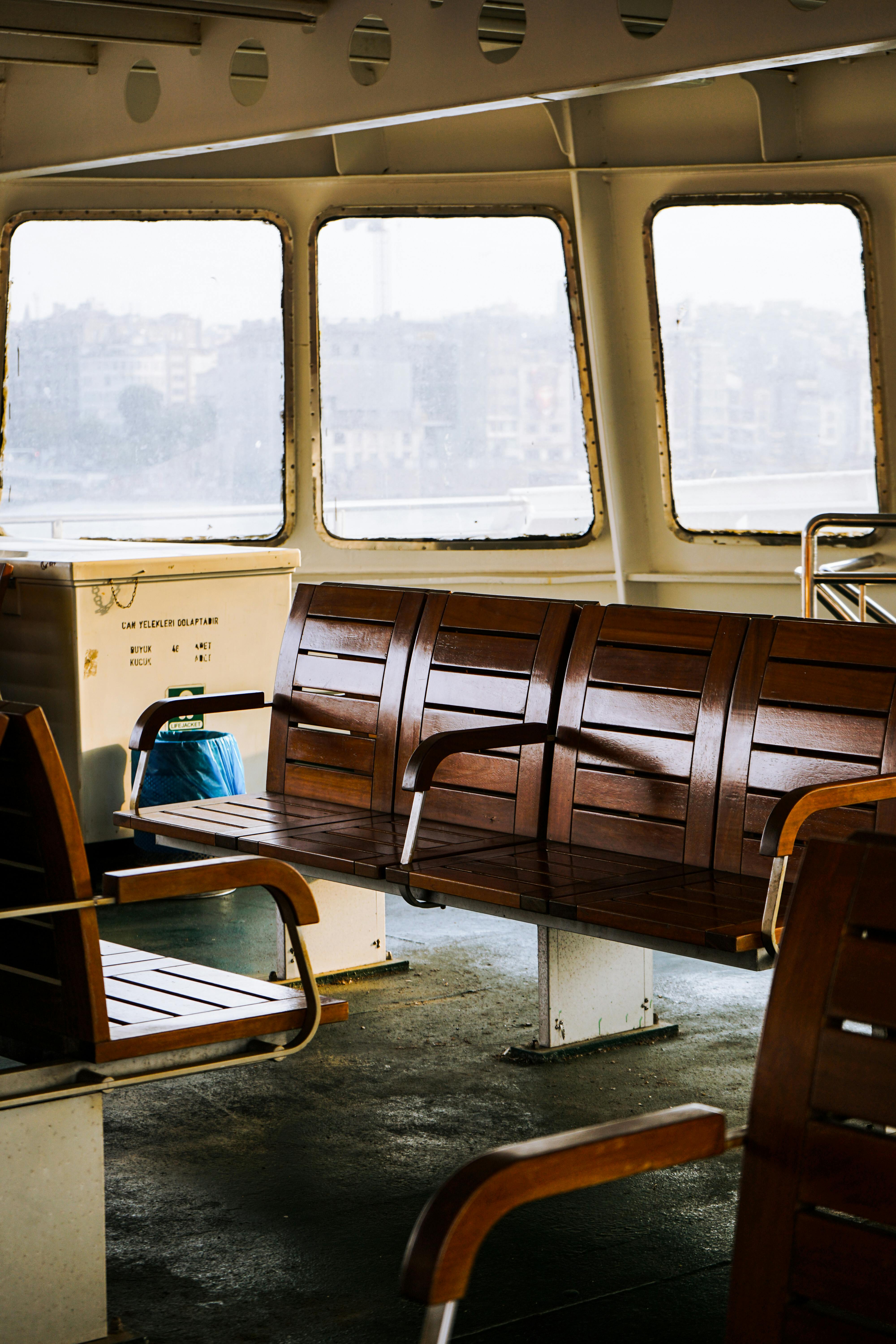 Inside of a Ship with Wooden Seats · Free Stock Photo