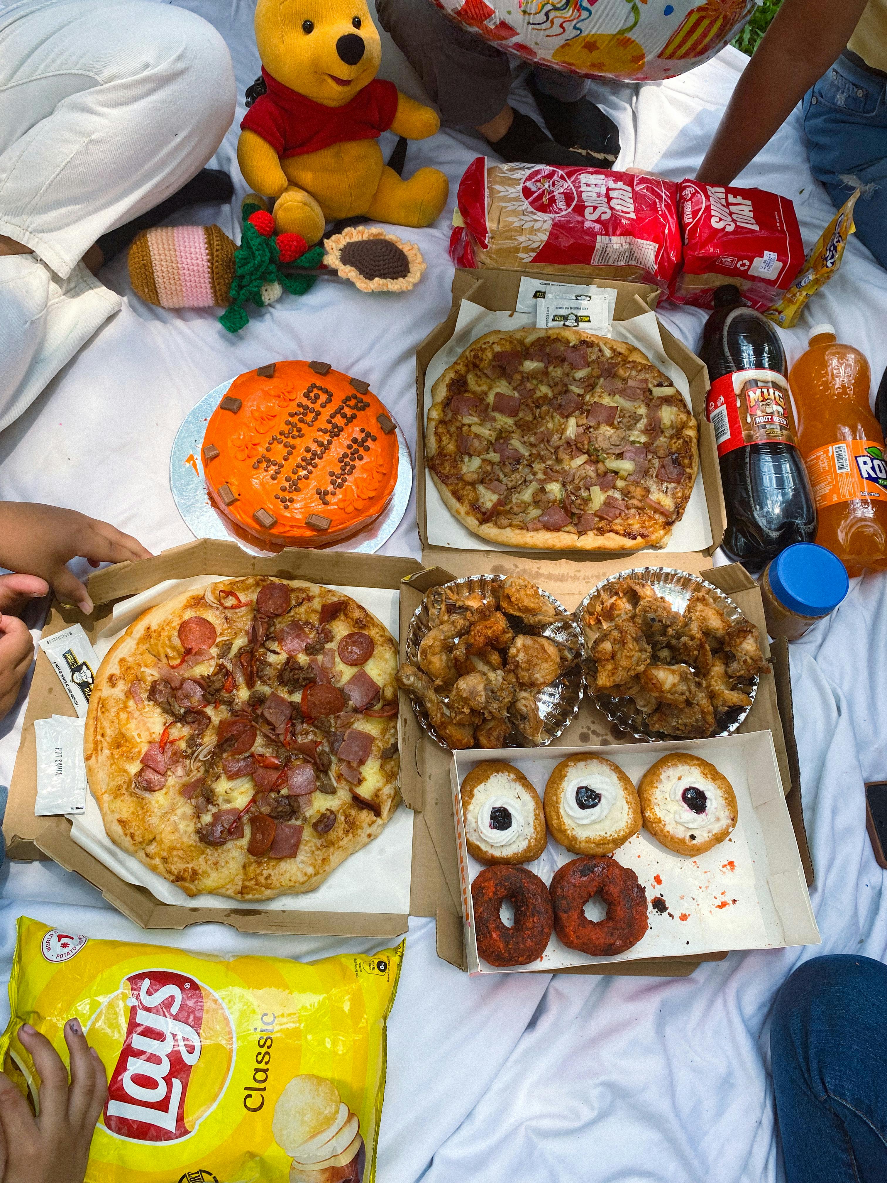 Birthday Cake Pizzas and Other Snacks for Party · Free Stock Photo