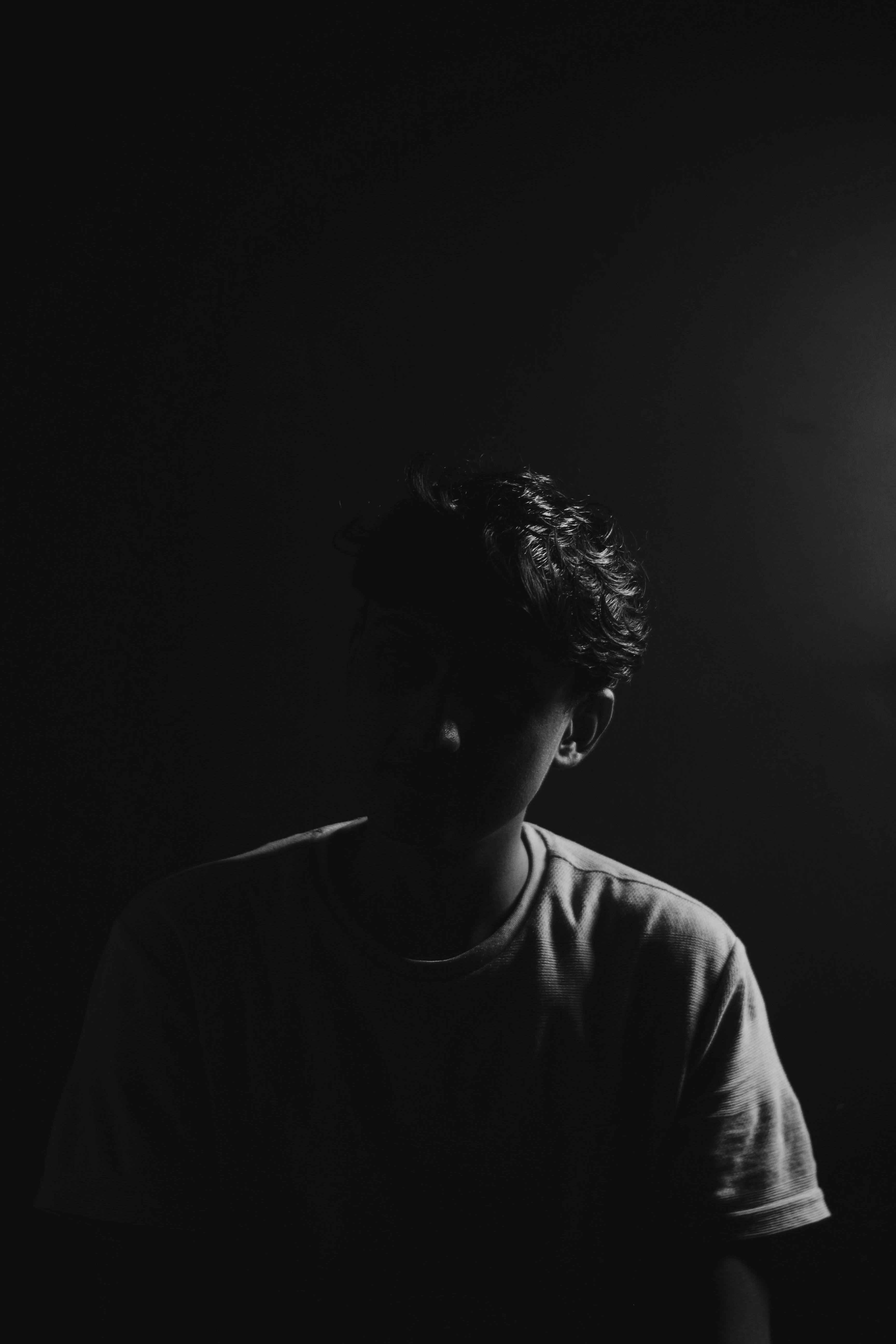 Back of a Man Pulling his T-Shirt up · Free Stock Photo