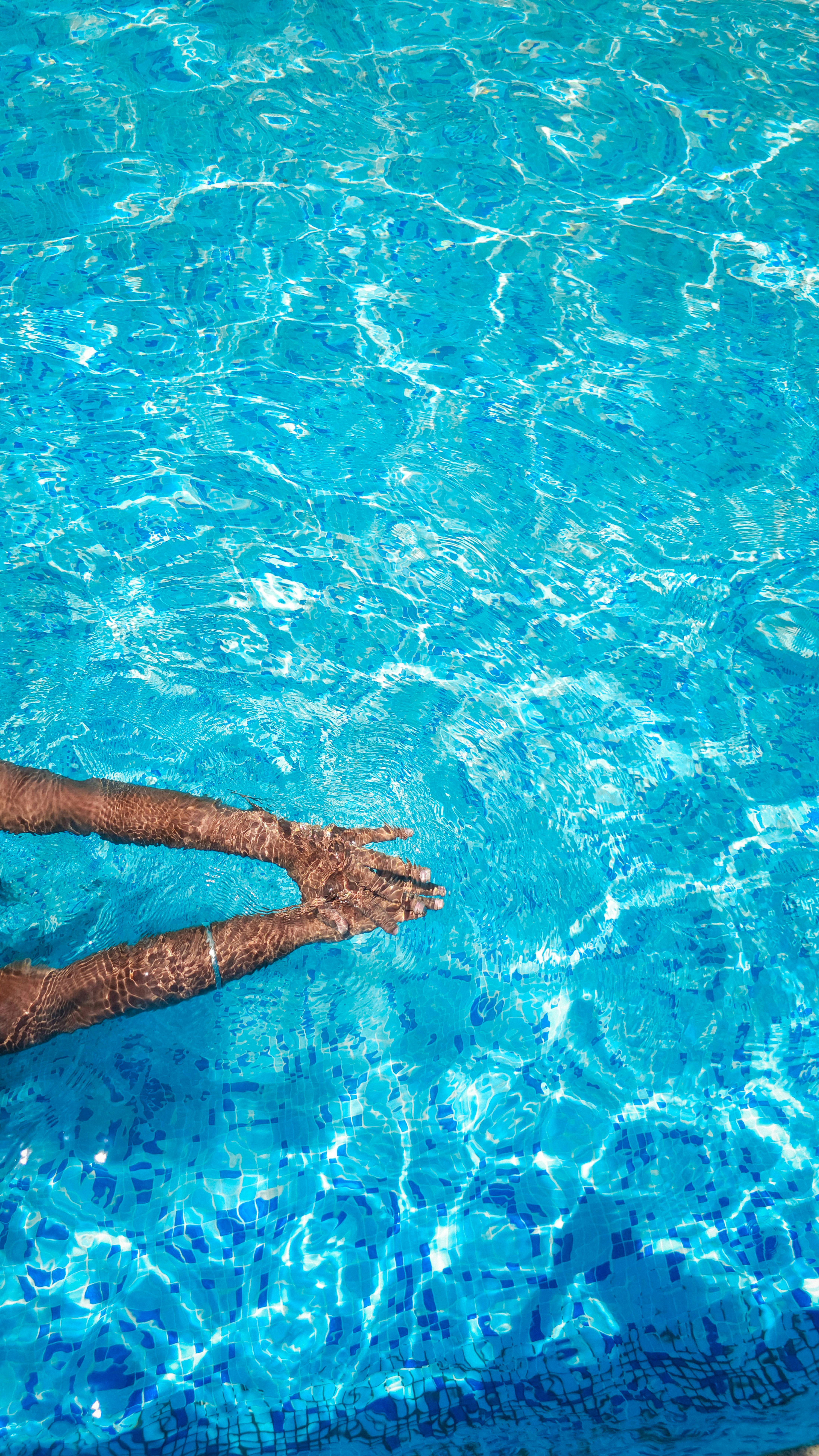 Hands of Swimmer in Swimming Pool · Free Stock Photo