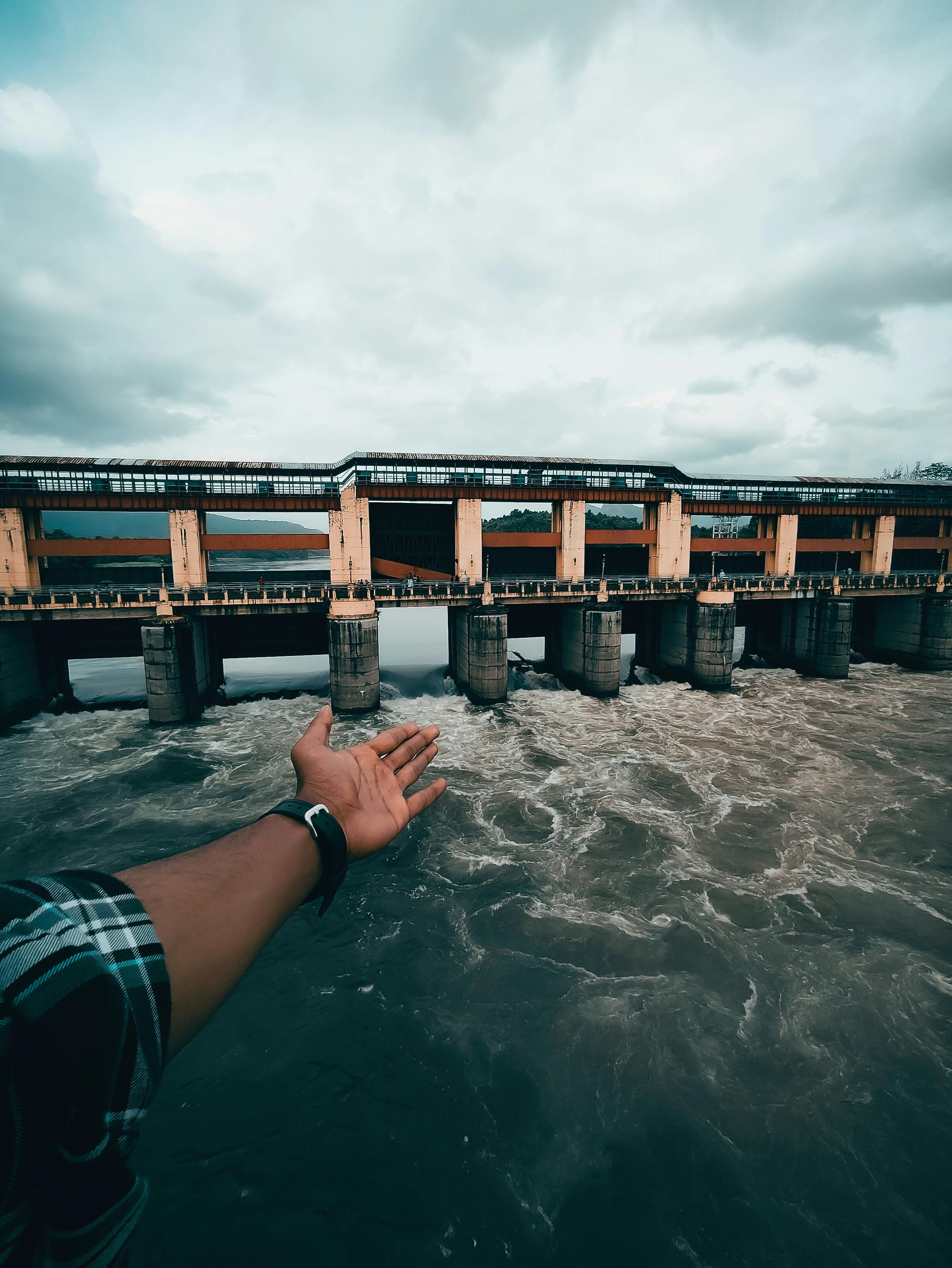 Hand Pointing at Dam · Free Stock Photo