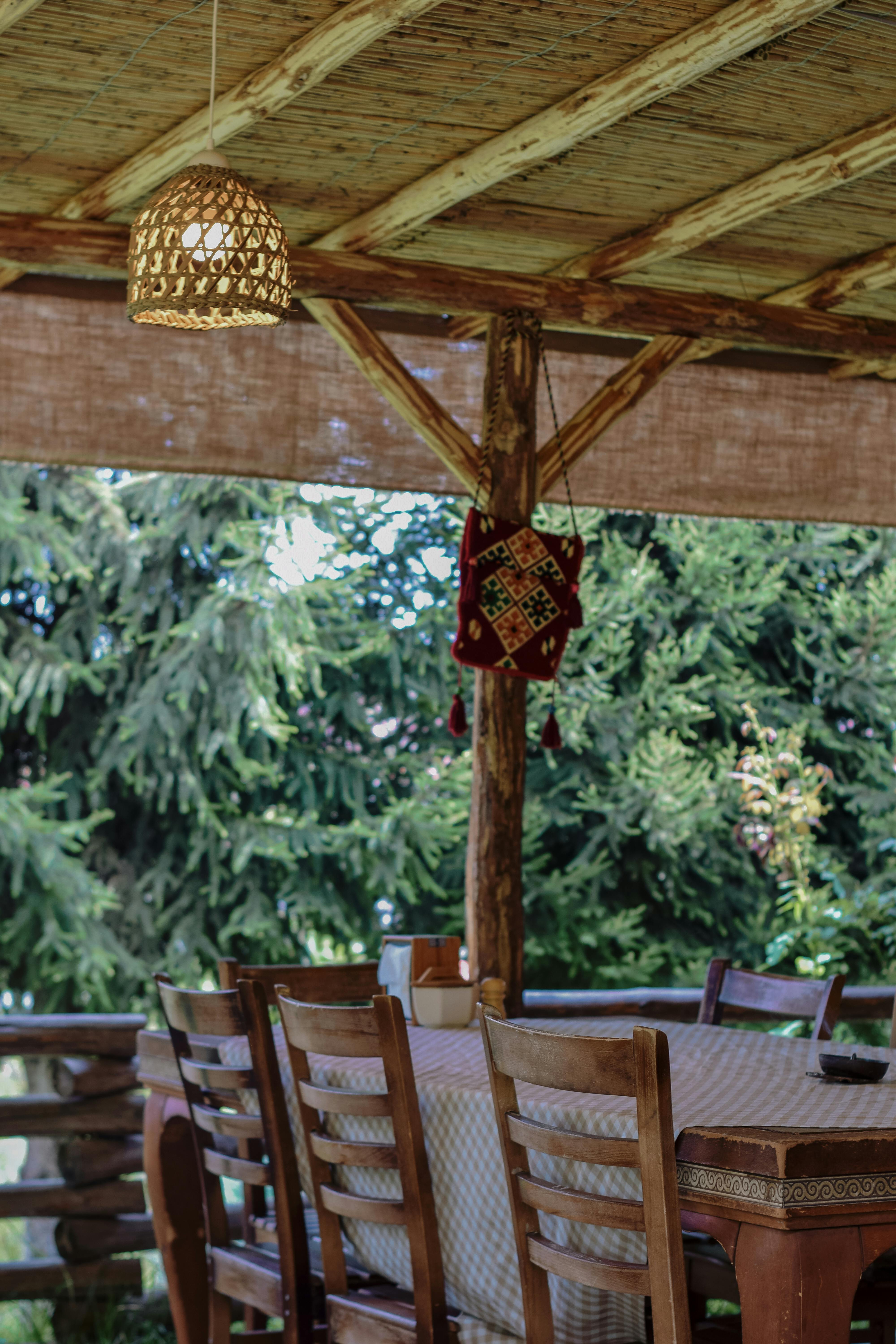 Tables and Chairs Under the Wooden Canopy · Free Stock Photo