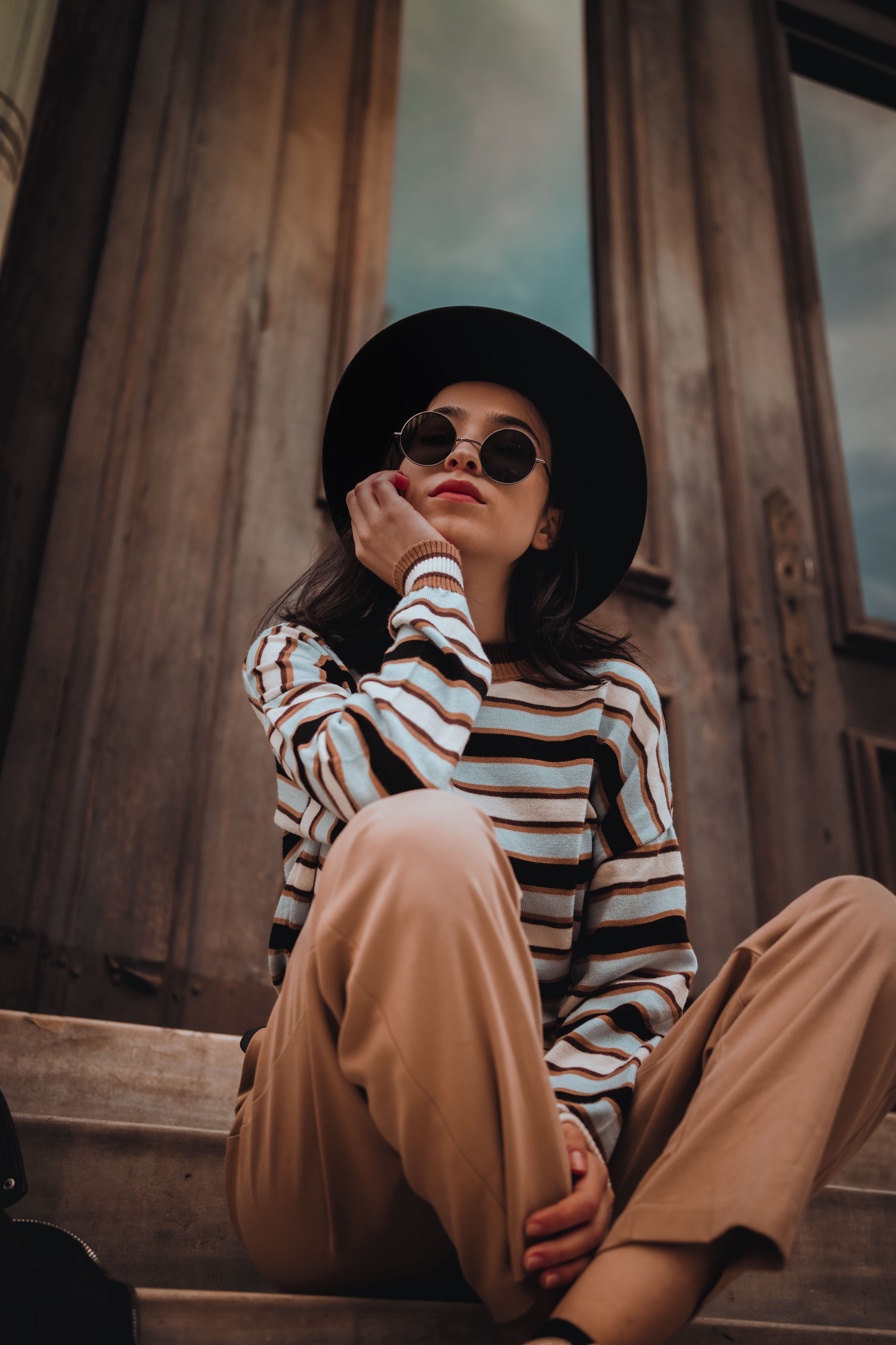 Young Girl Sitting on the Stairs of a Building · Free Stock Photo
