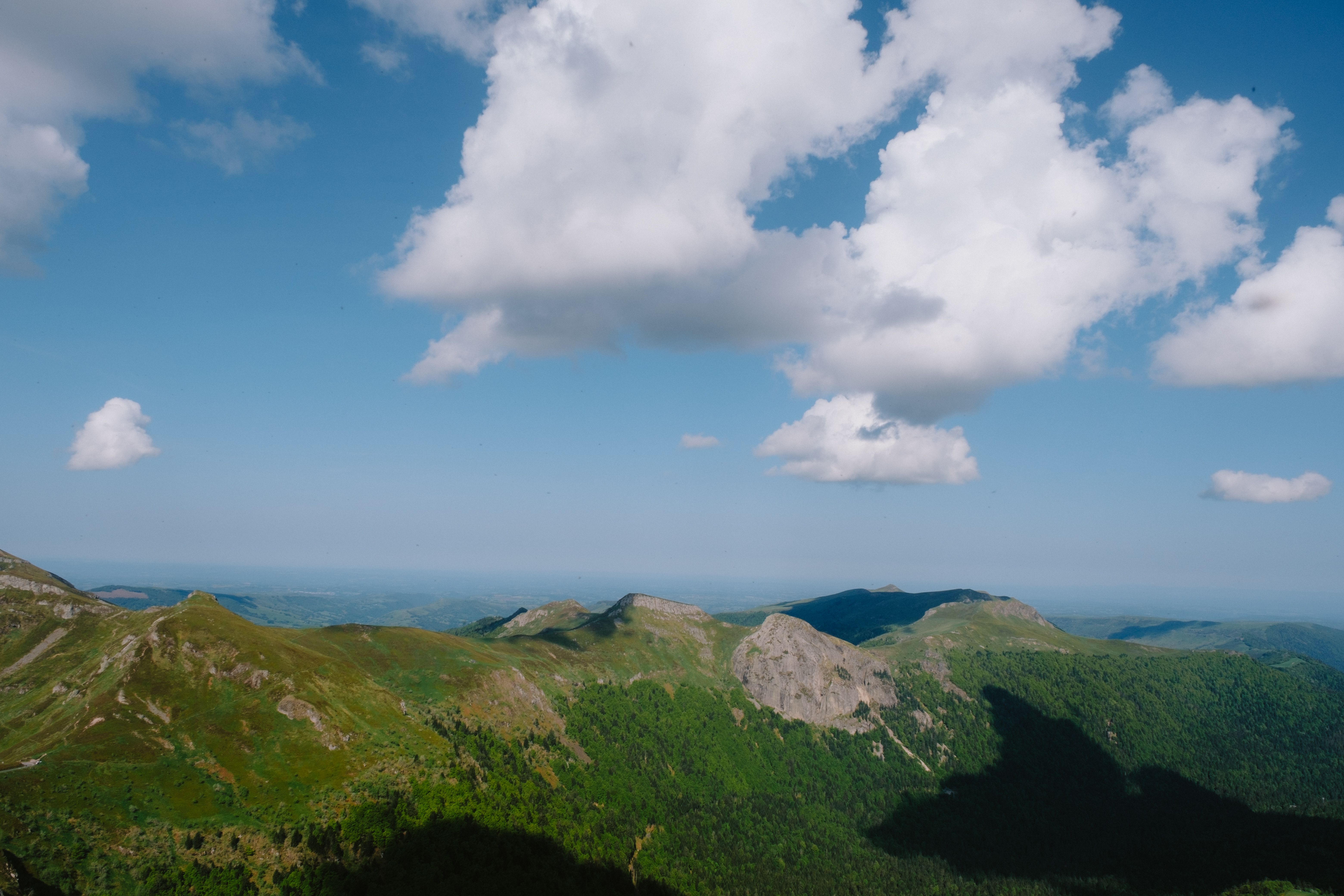 Green Mountain Under Cloudy Sky during Daytime · Free Stock Photo