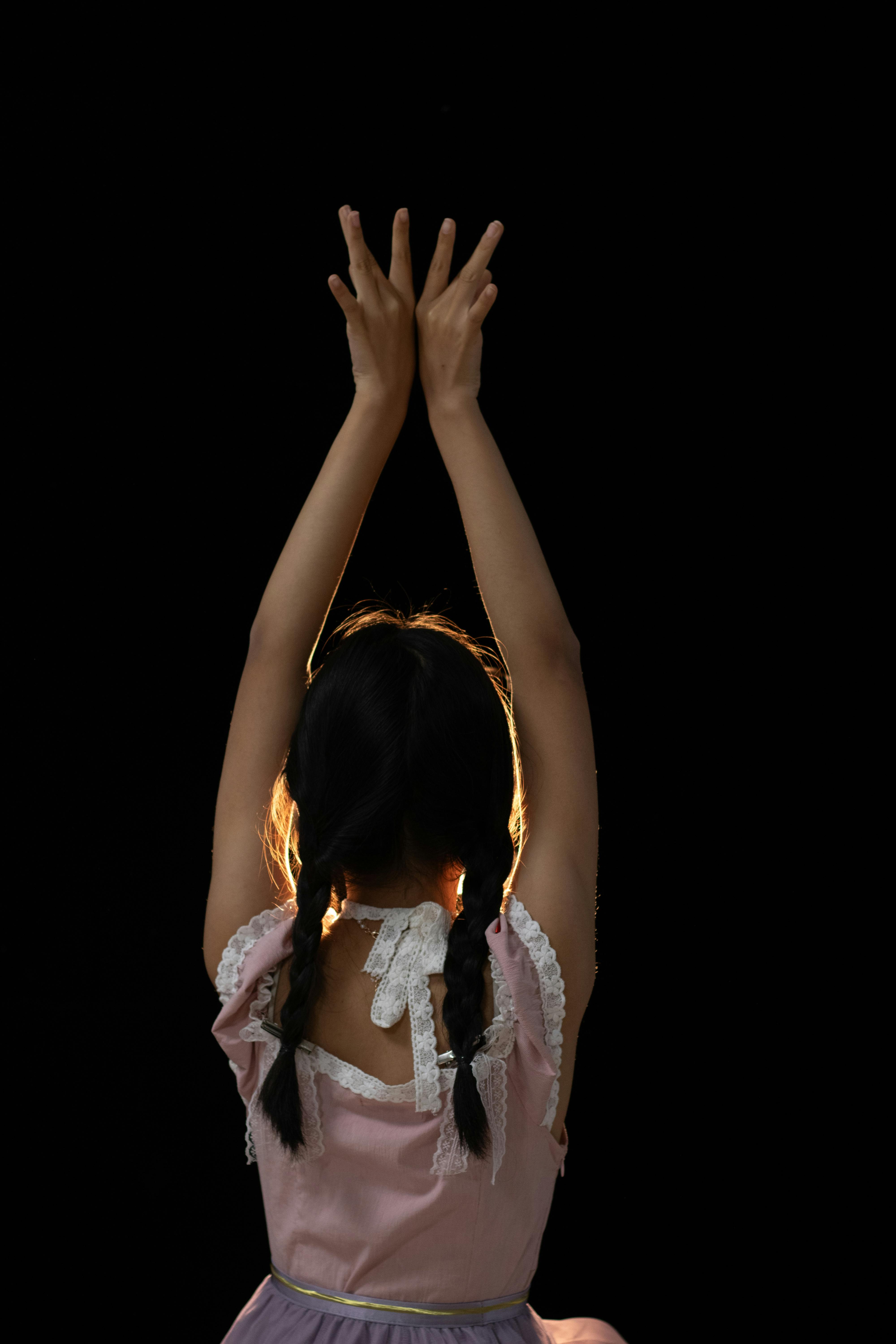 Back View of Woman with Arms Raised · Free Stock Photo