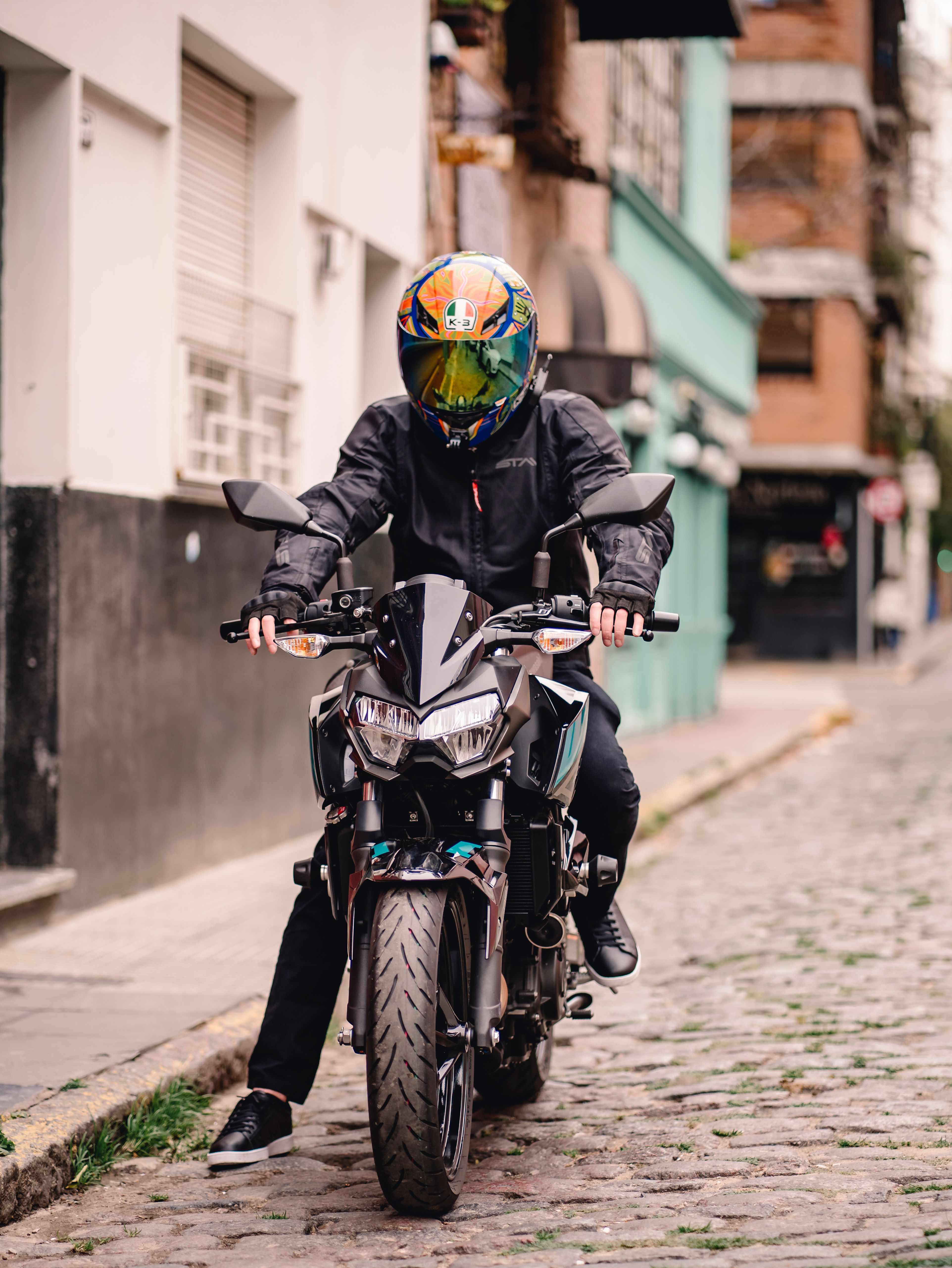Person in Biker Gear and Helmet Sitting on Kawasaki Motorcycle · Free ...
