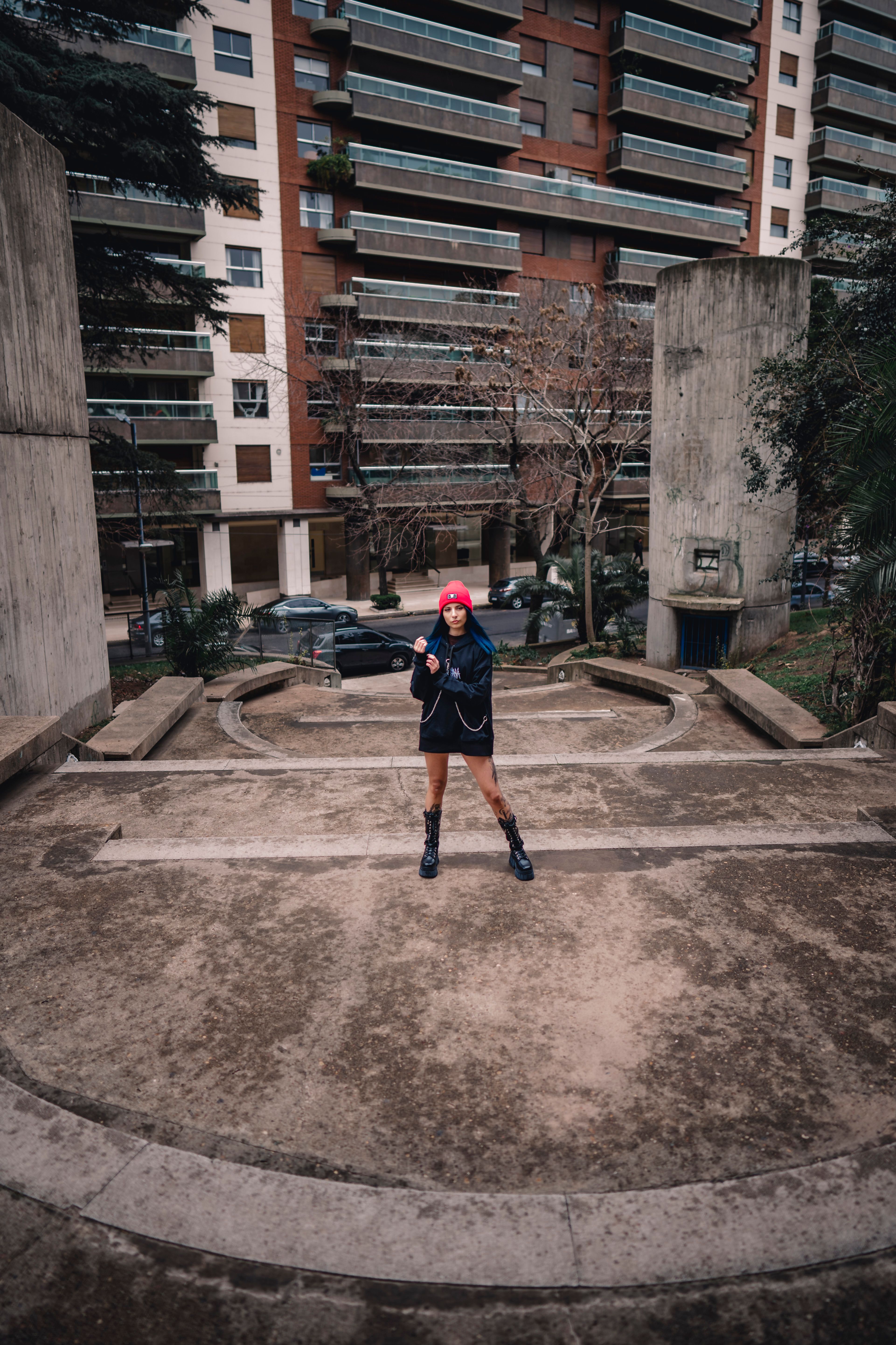Woman Standing on Pavement in City · Free Stock Photo