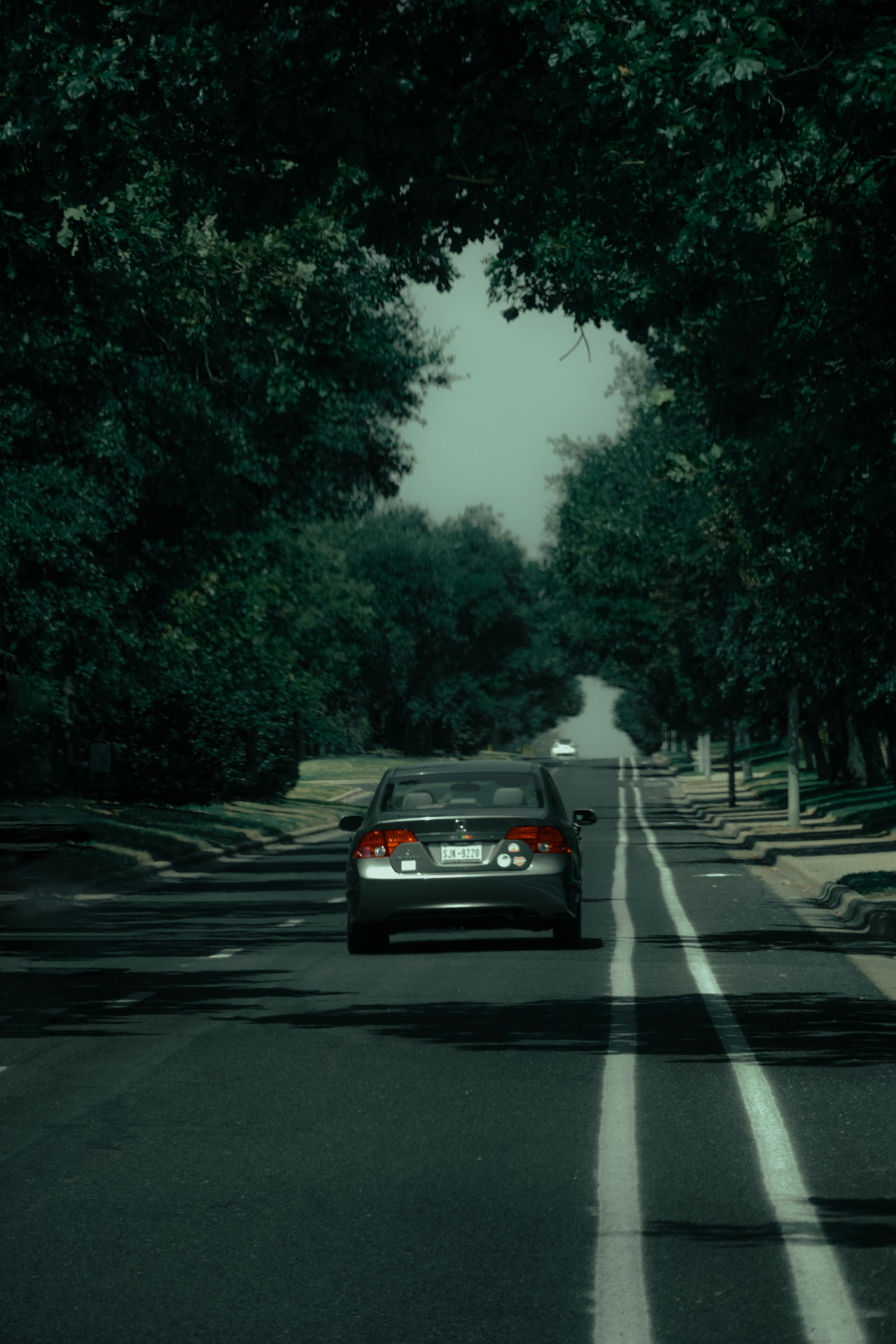 Car Running on Straight Road · Free Stock Photo