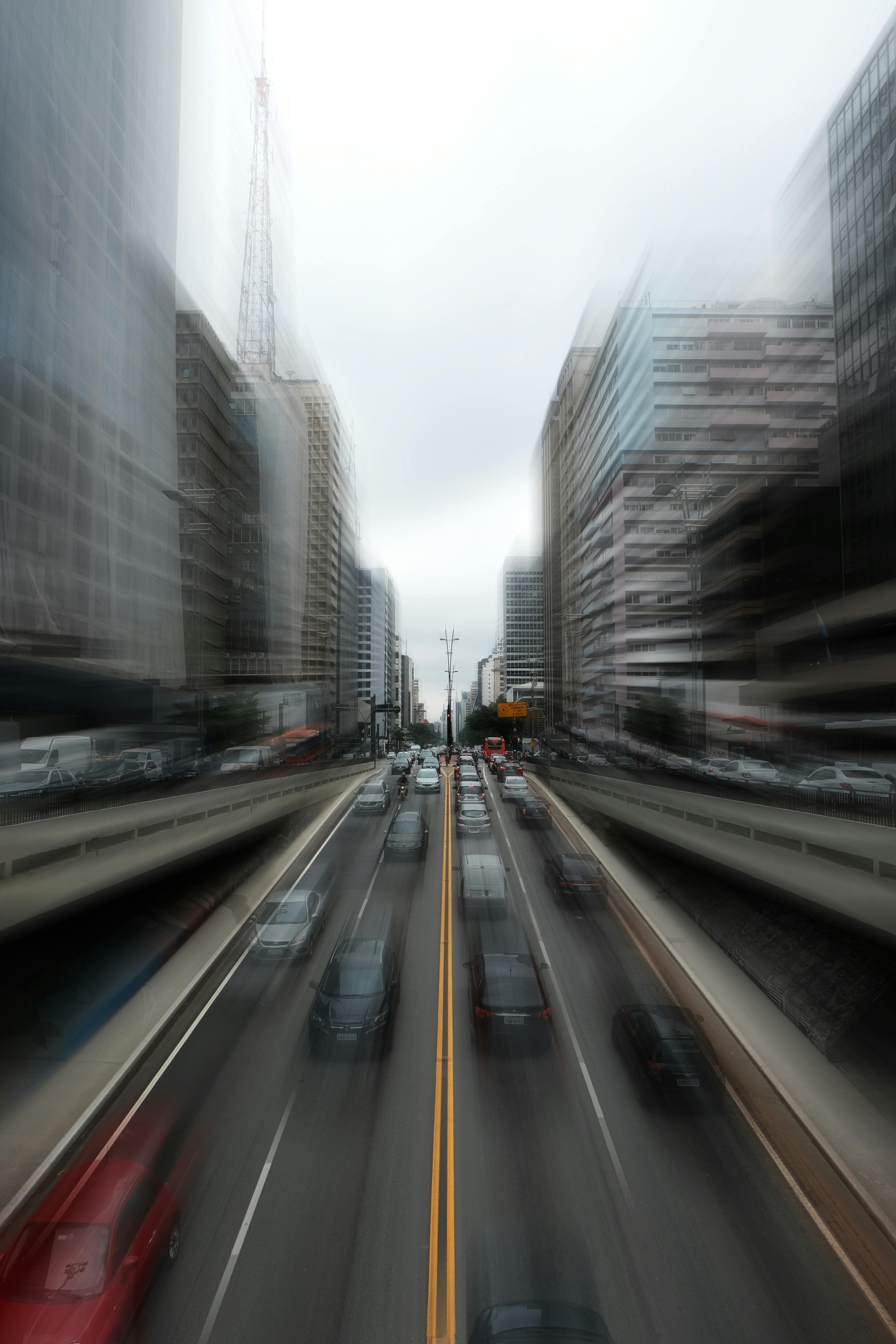 Time Lapse Photography of Moving Cars on the Road Between High Rise ...