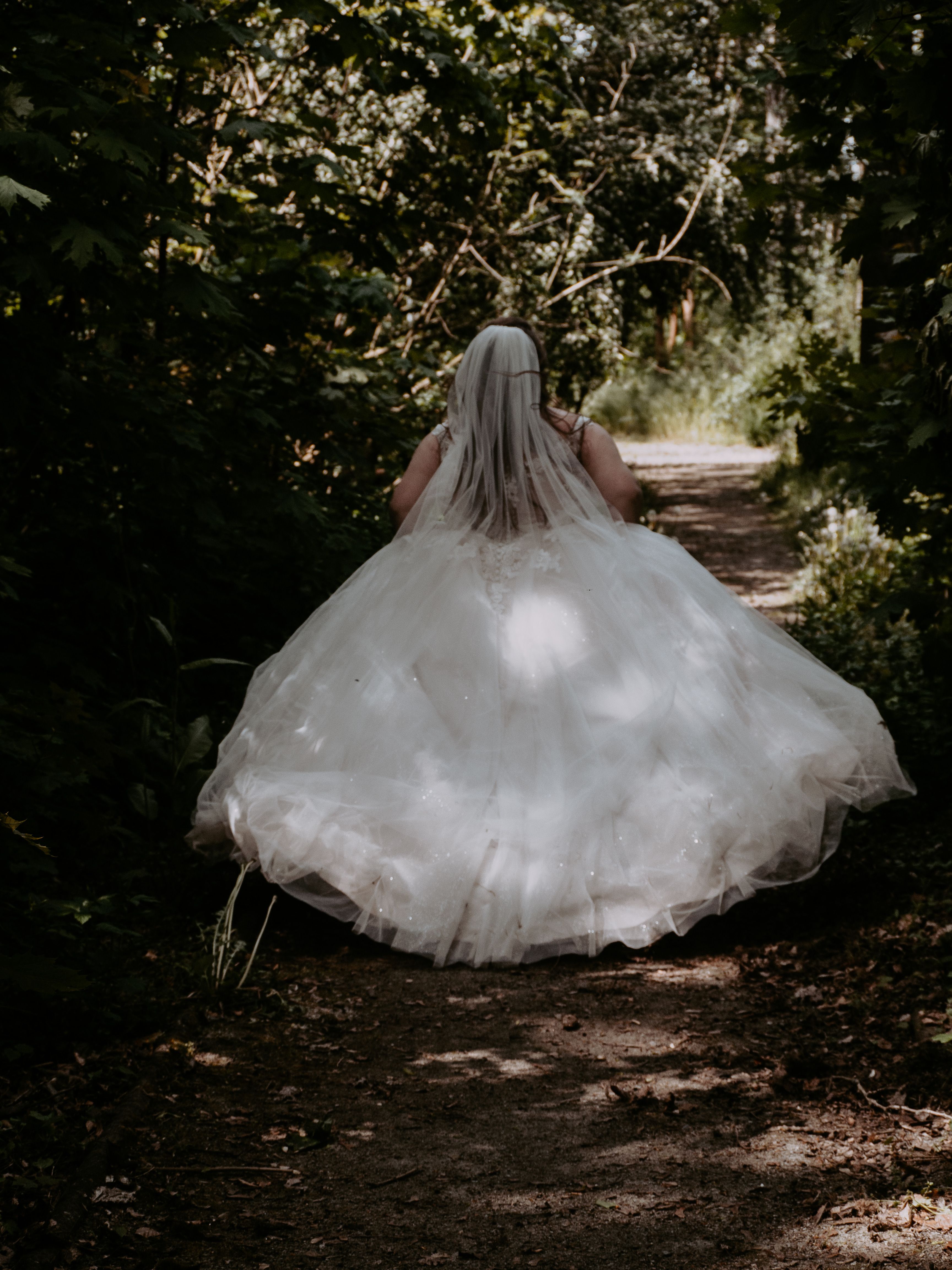 Bride Walking Along a Forest Path · Free Stock Photo