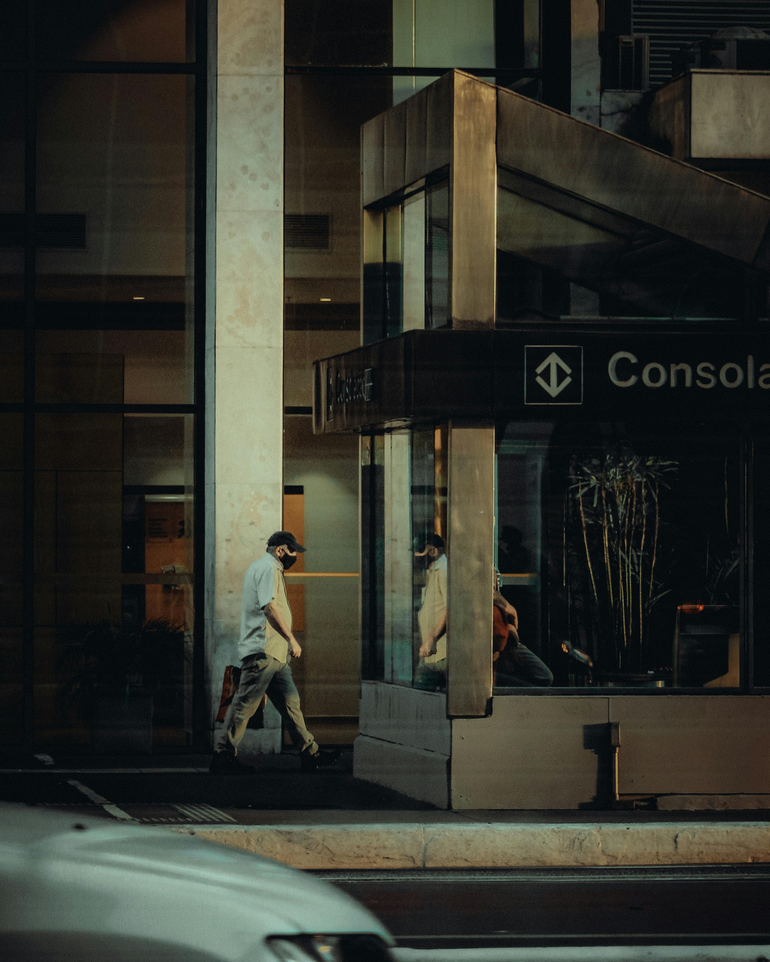 Elderly Passerby Walking on the Sidewalk · Free Stock Photo