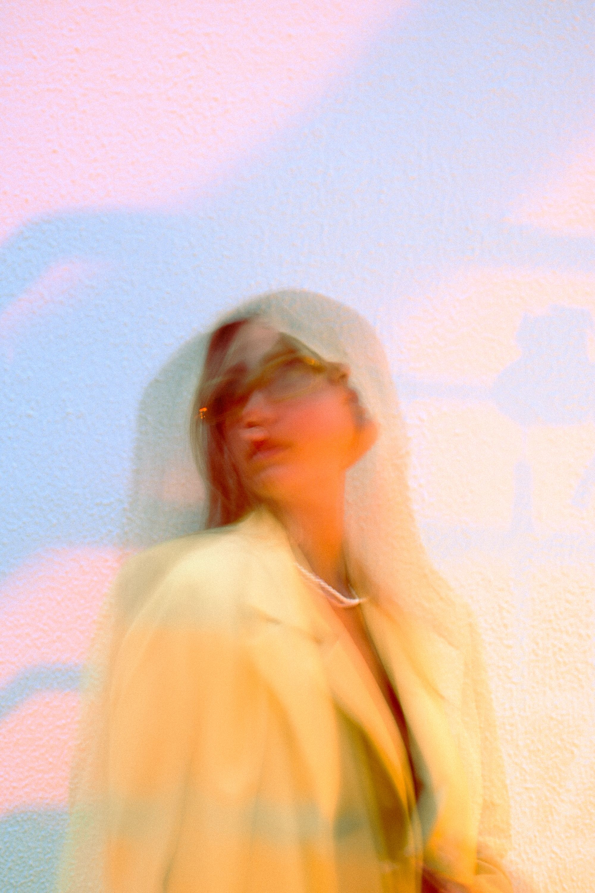 Blurry Woman in Yellow Blazer · Free Stock Photo