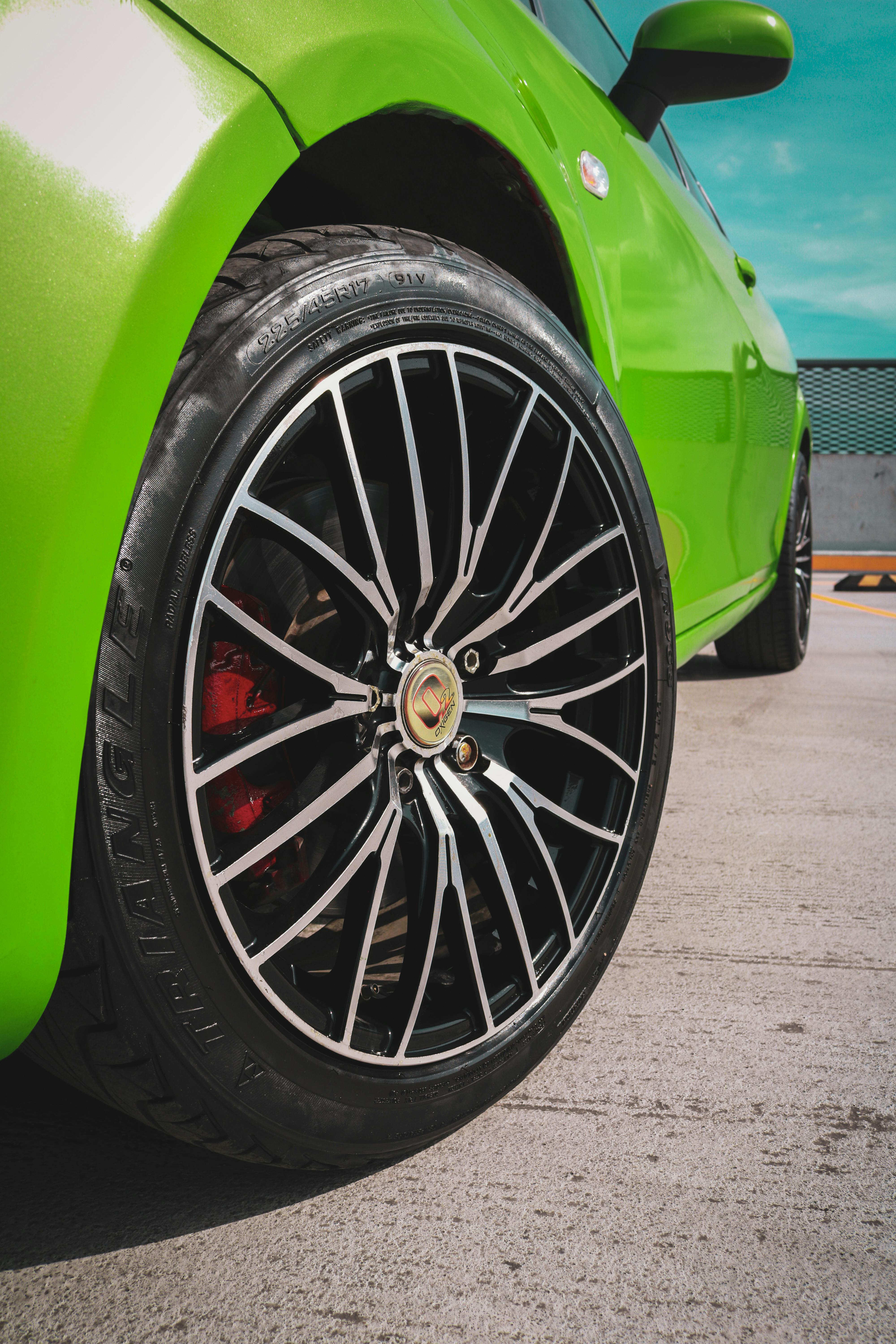 Front wheel of a green Seat Leon · Free Stock Photo