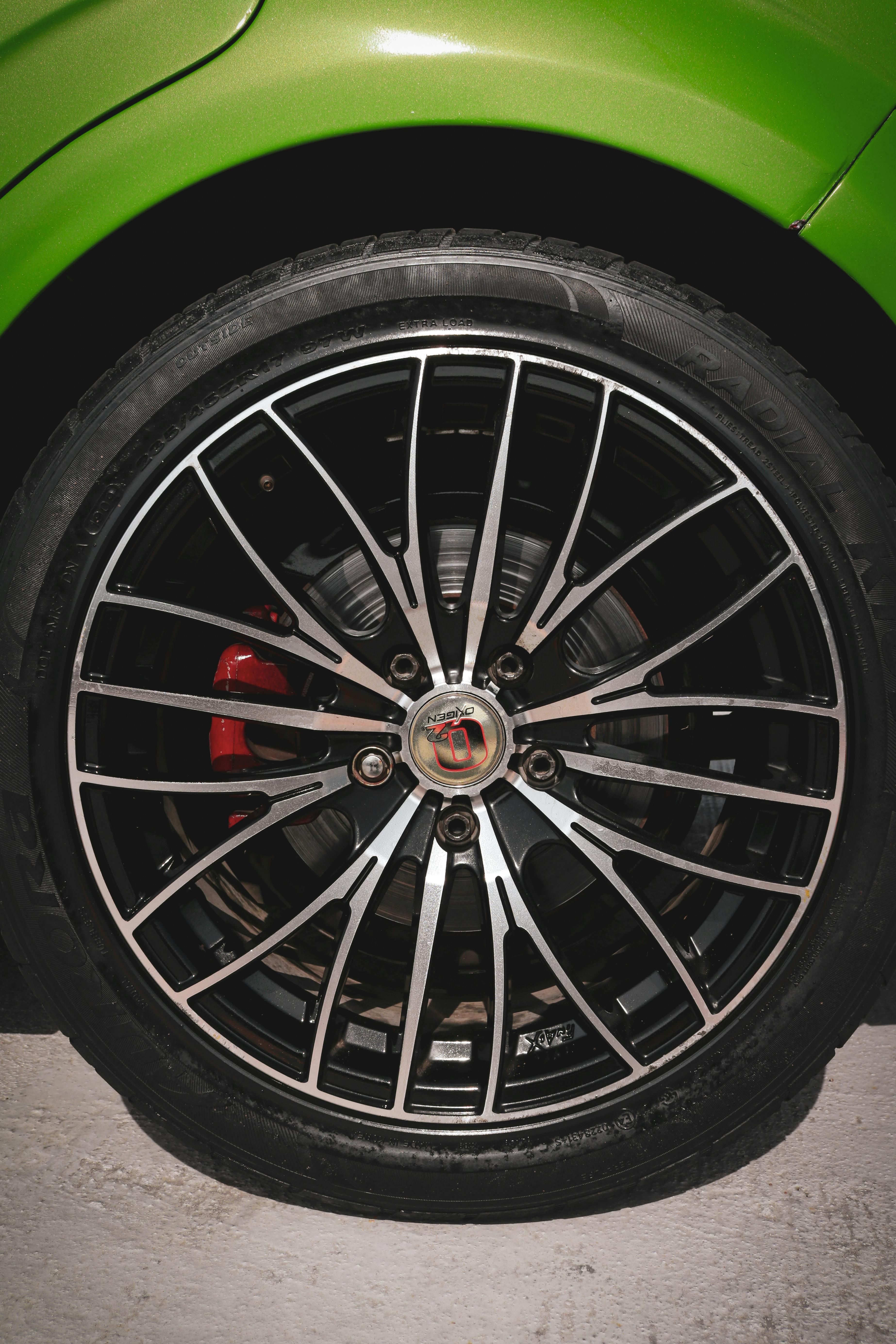 Rear Wheel of a Green Car · Free Stock Photo