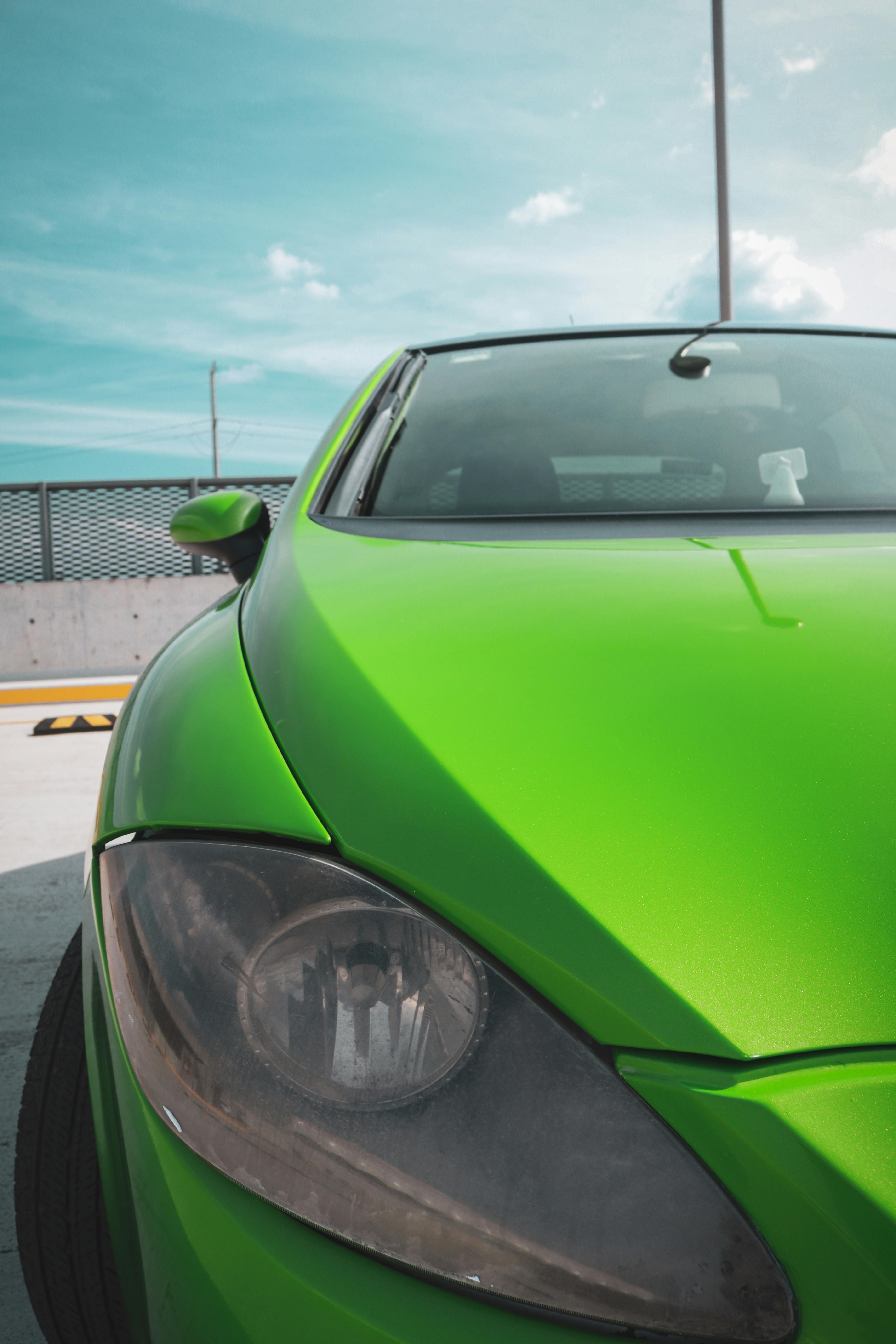 Front of a Green Chrome Car · Free Stock Photo