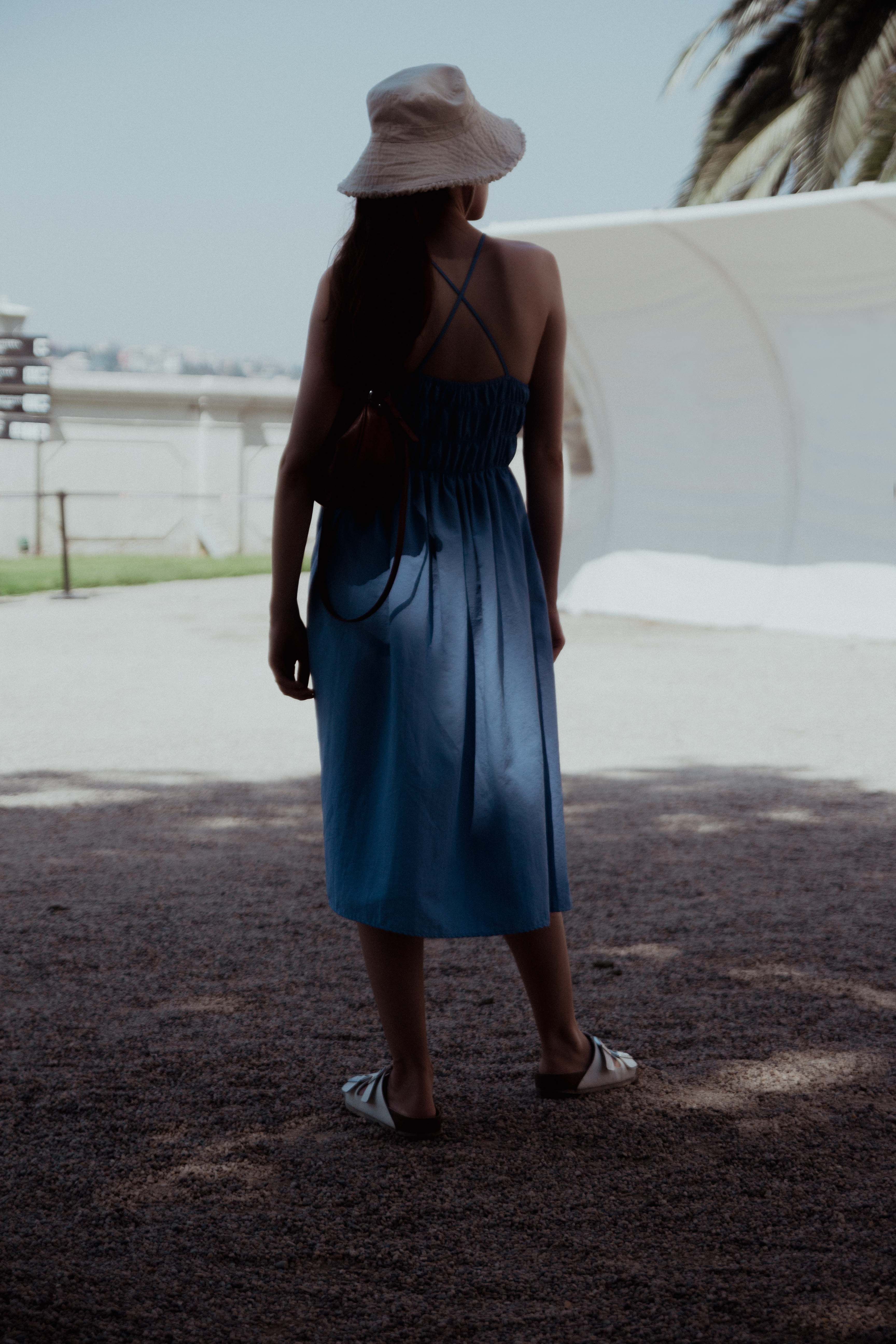 Back View of Woman in Hat and Blue Sundress · Free Stock Photo