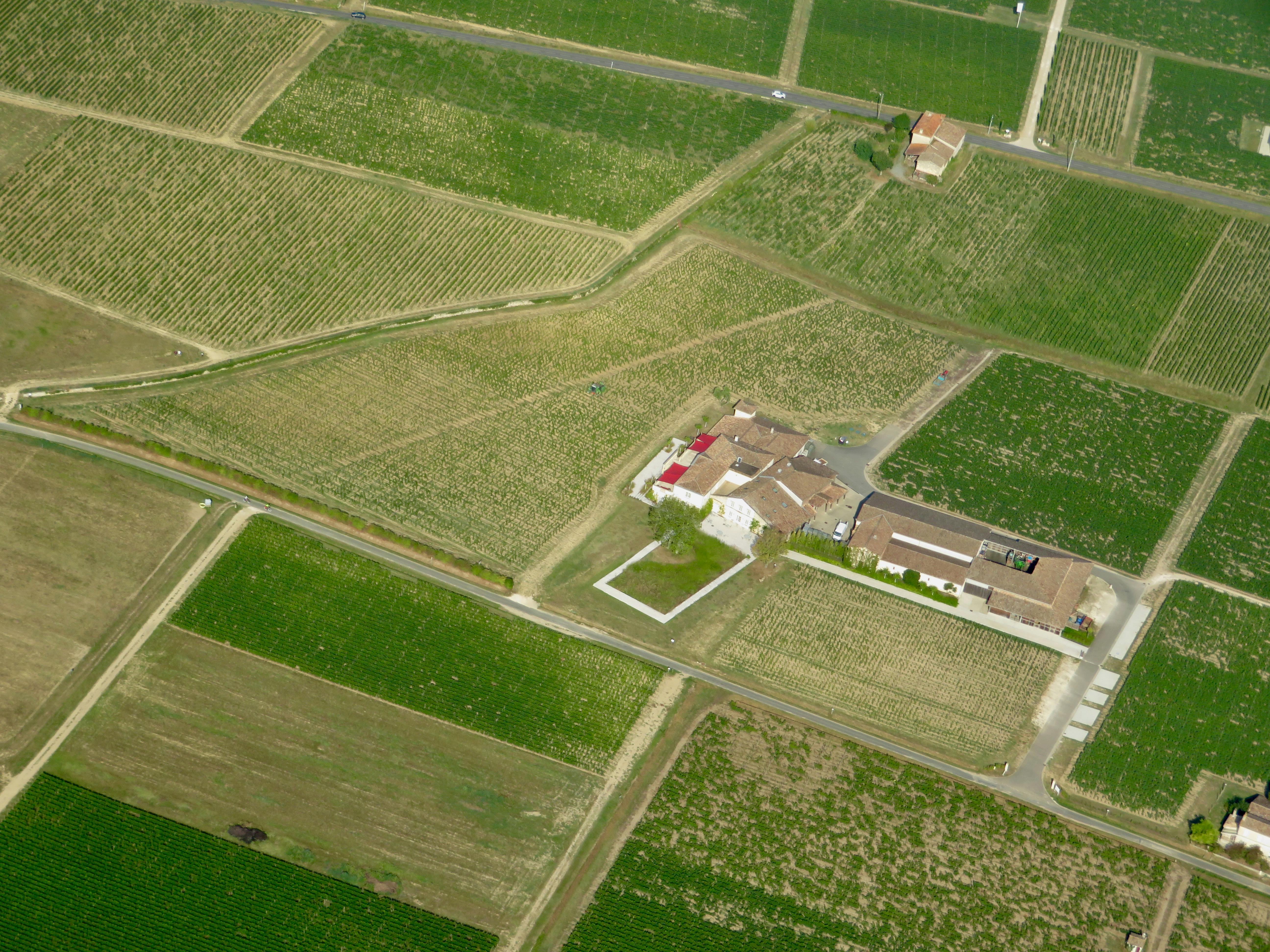 Aerial View of a Farm and Fields · Free Stock Photo