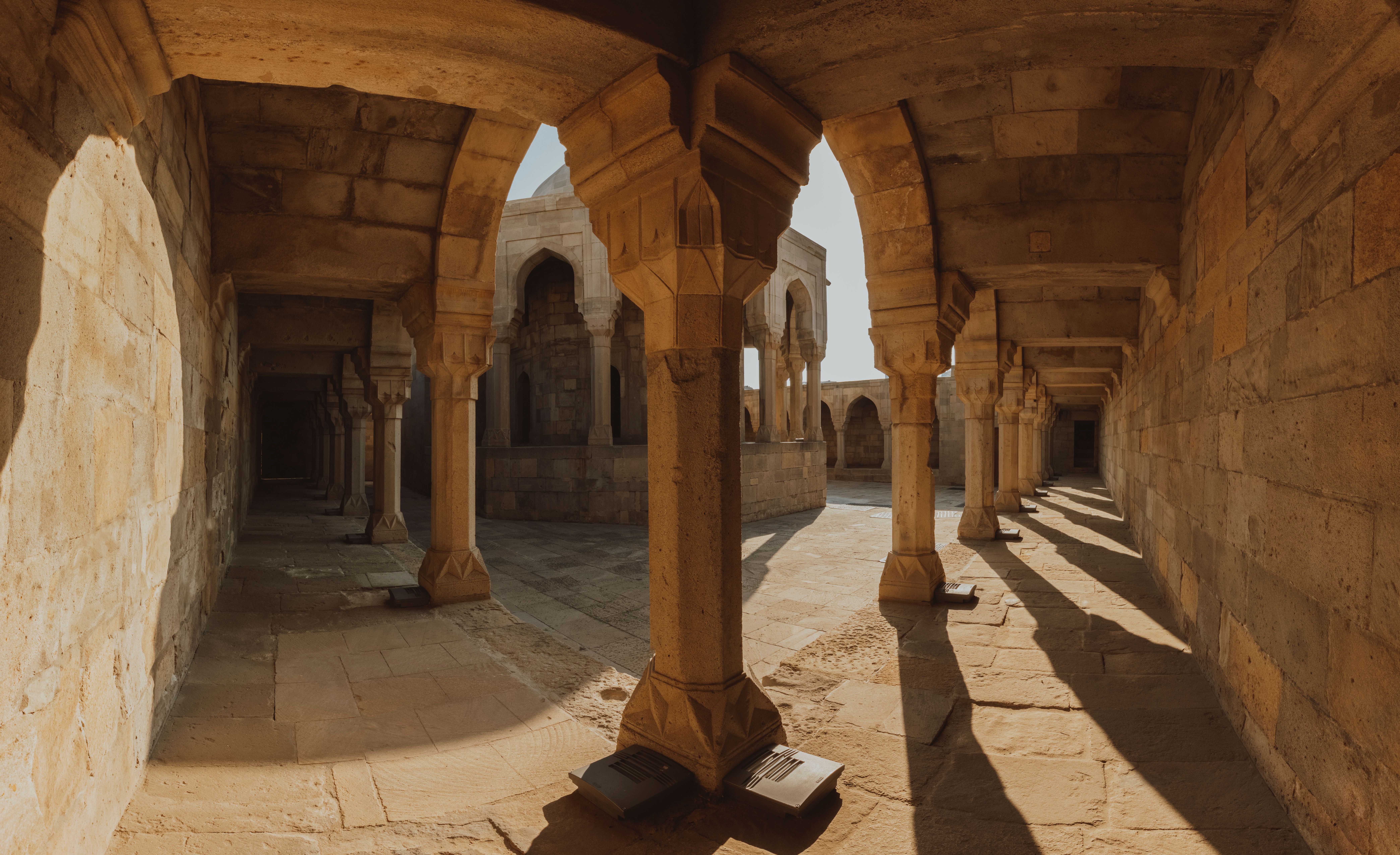 The inside of an old building with pillars · Free Stock Photo