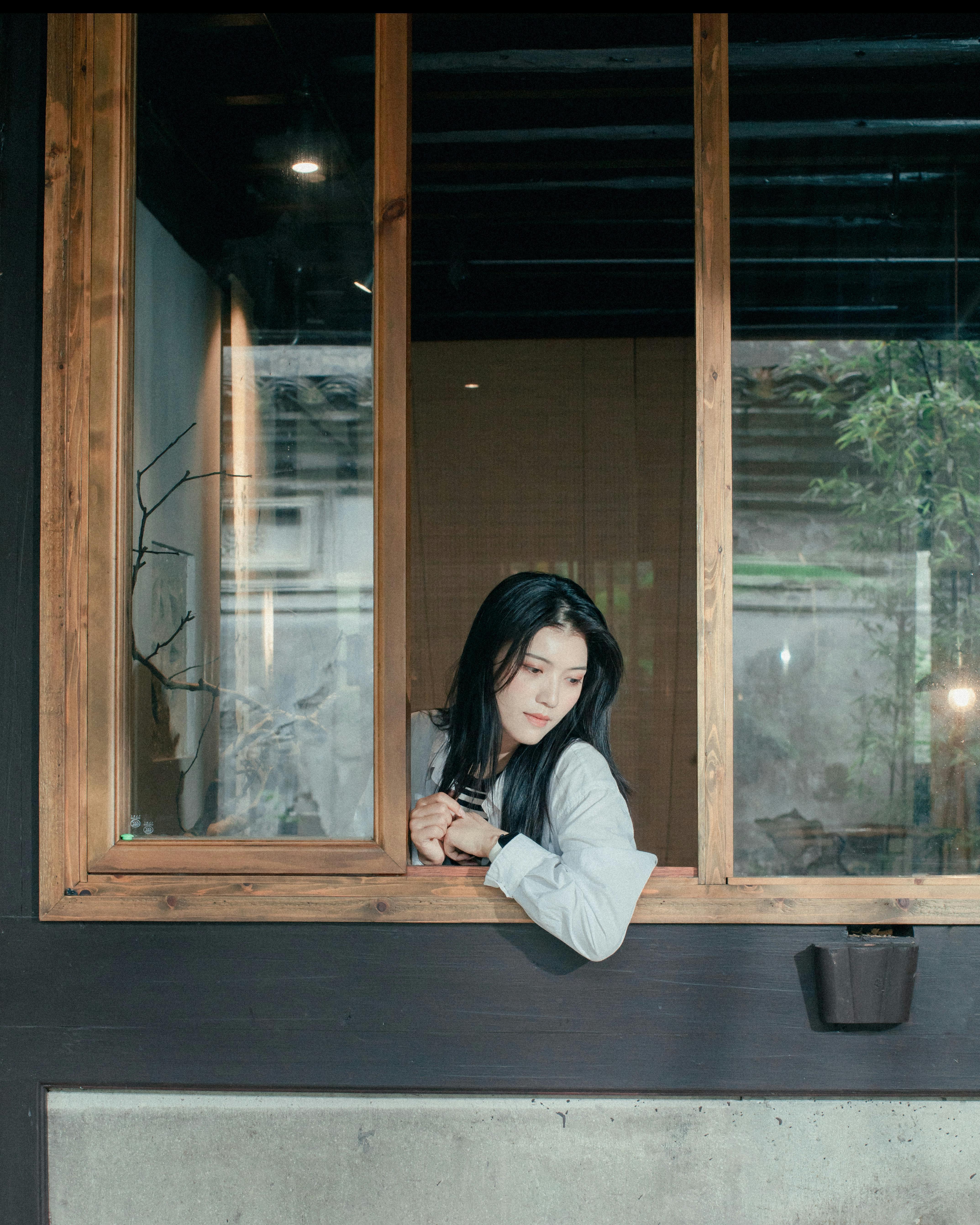 Woman Looking Down through Windows · Free Stock Photo