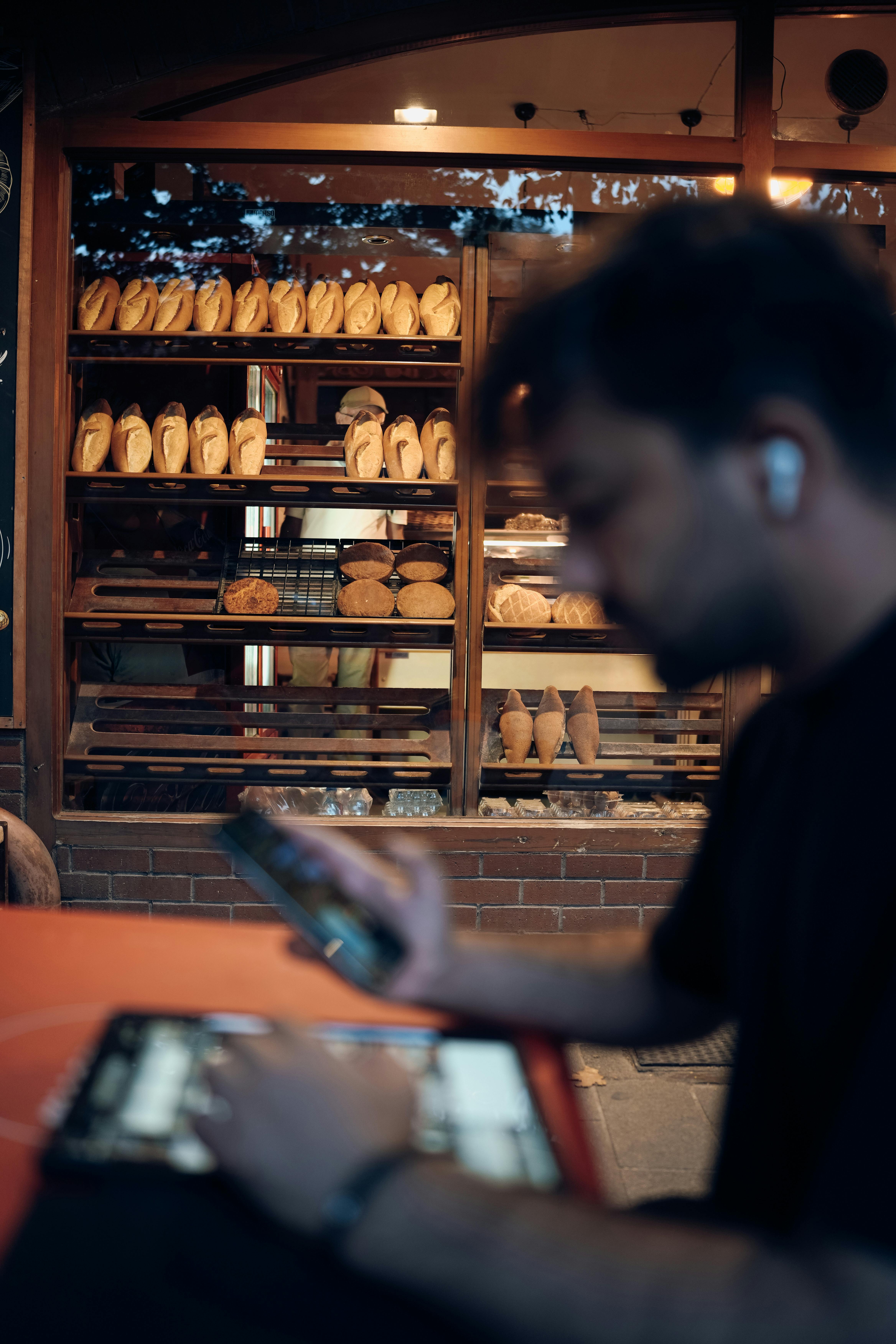 Man Sitting in Bakery · Free Stock Photo