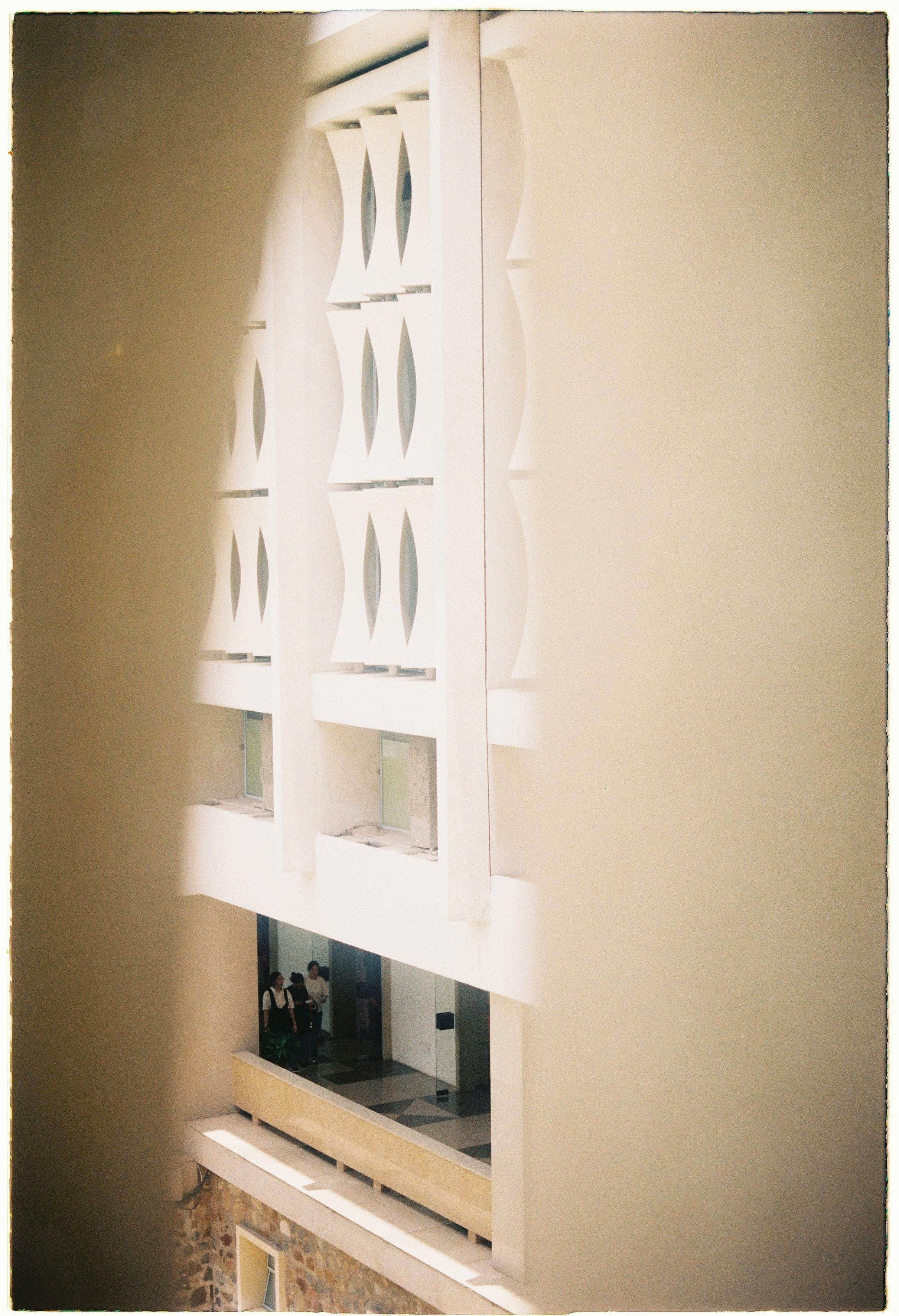 White Building Wall behind Gap · Free Stock Photo