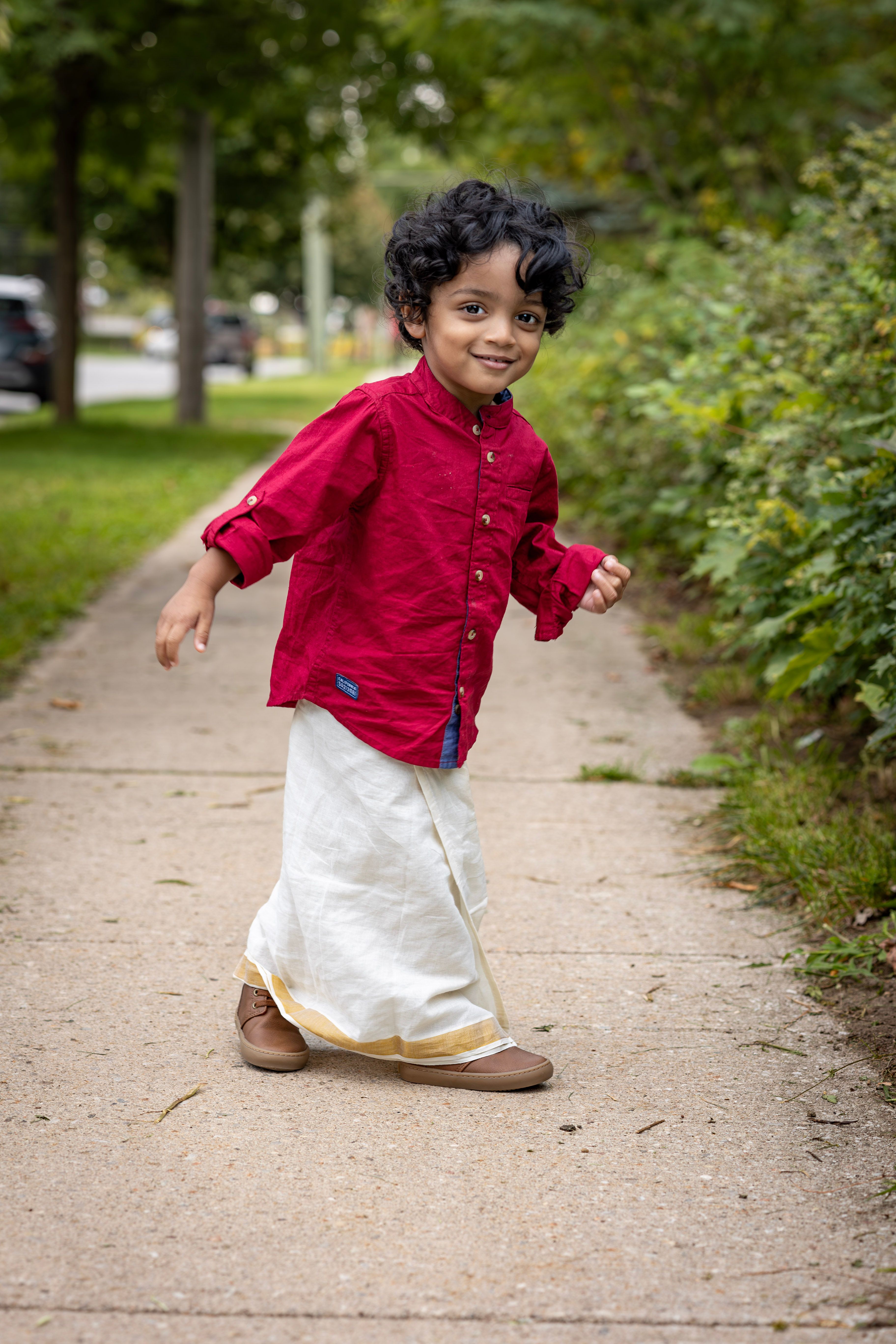 Happy Boy on the Sidewalk · Free Stock Photo