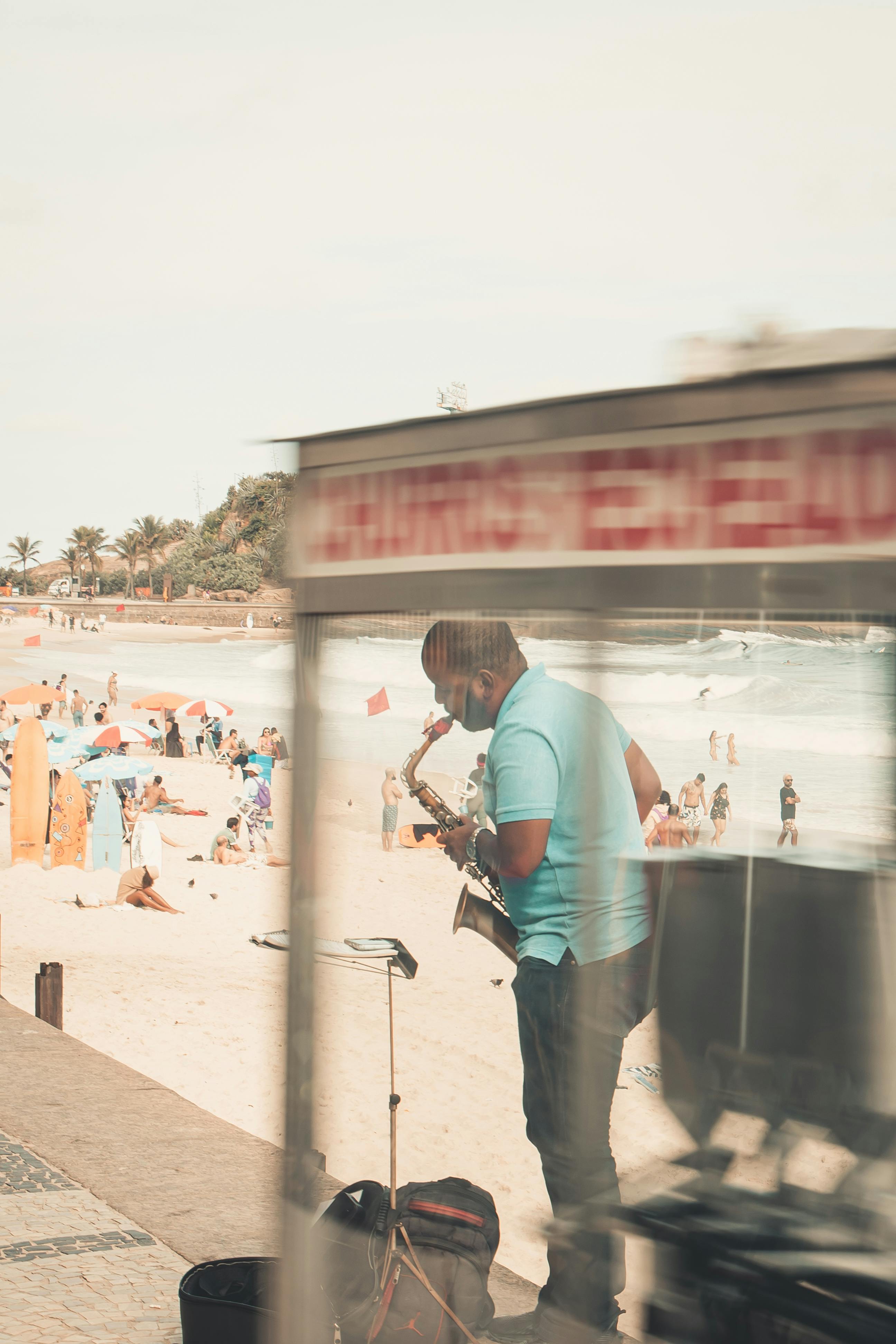 Busker on Beach · Free Stock Photo