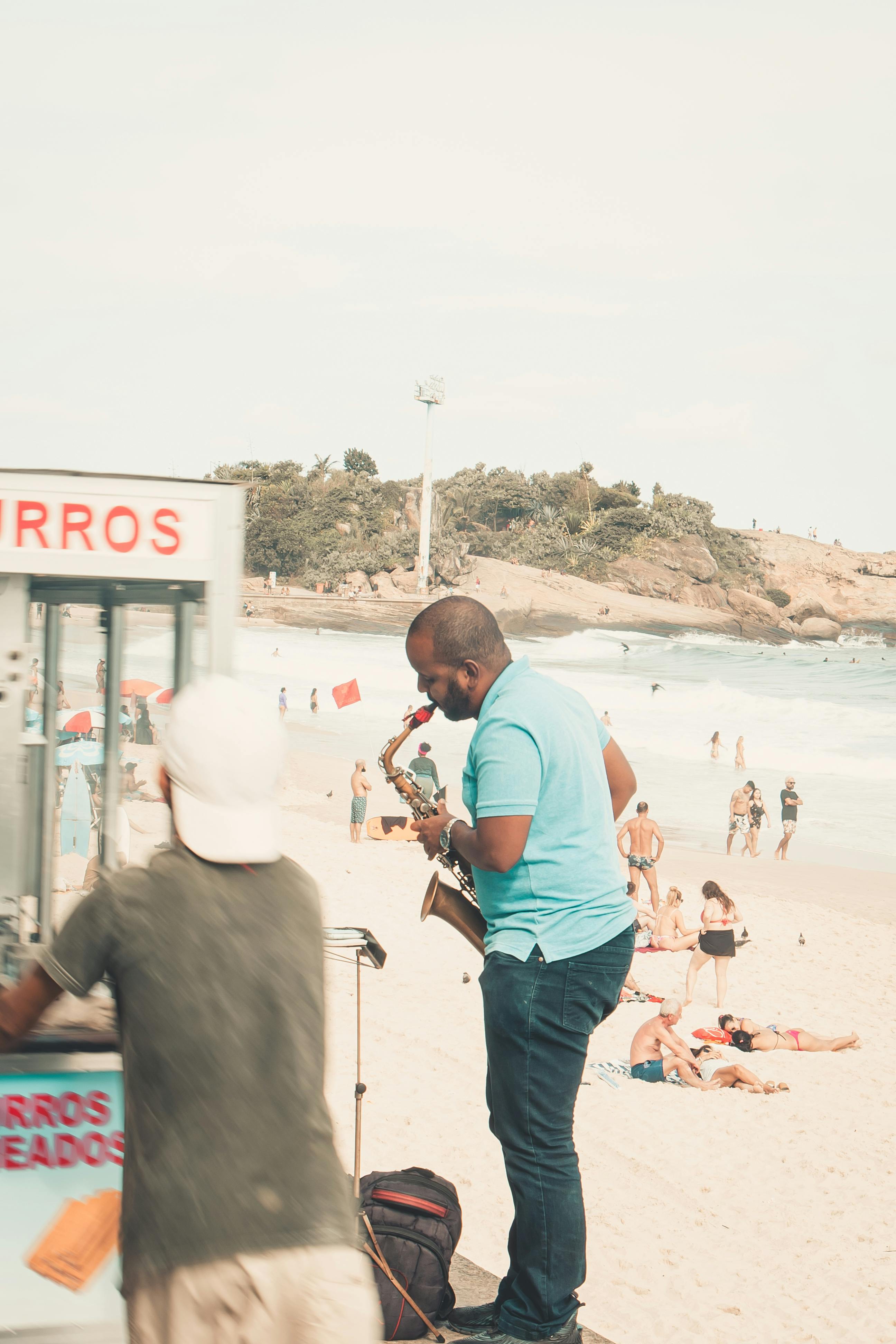 Busker on Beach · Free Stock Photo